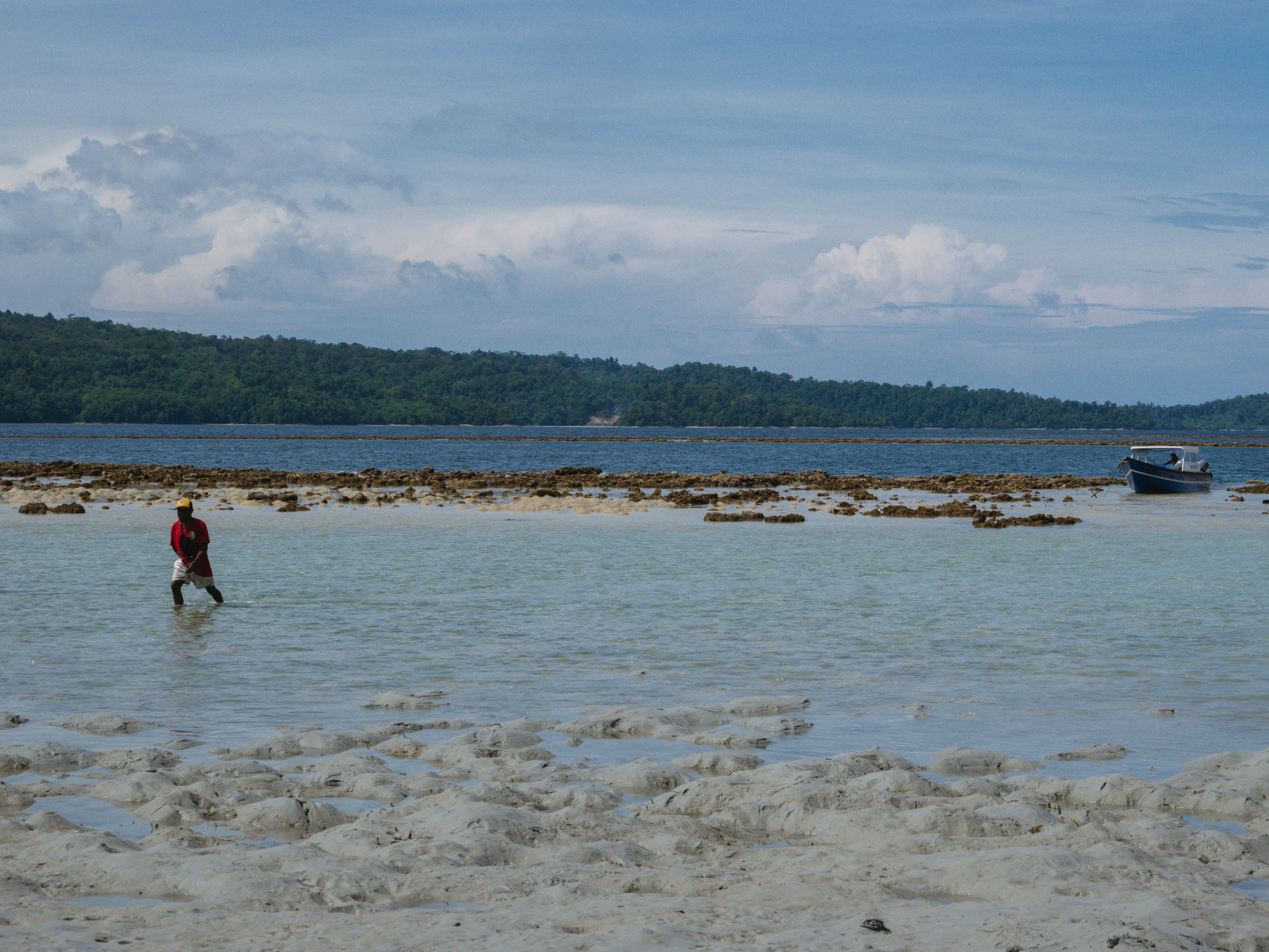 A skipper and a boat at Tanehamur village, Fakfak, West Papua, Indonesia..