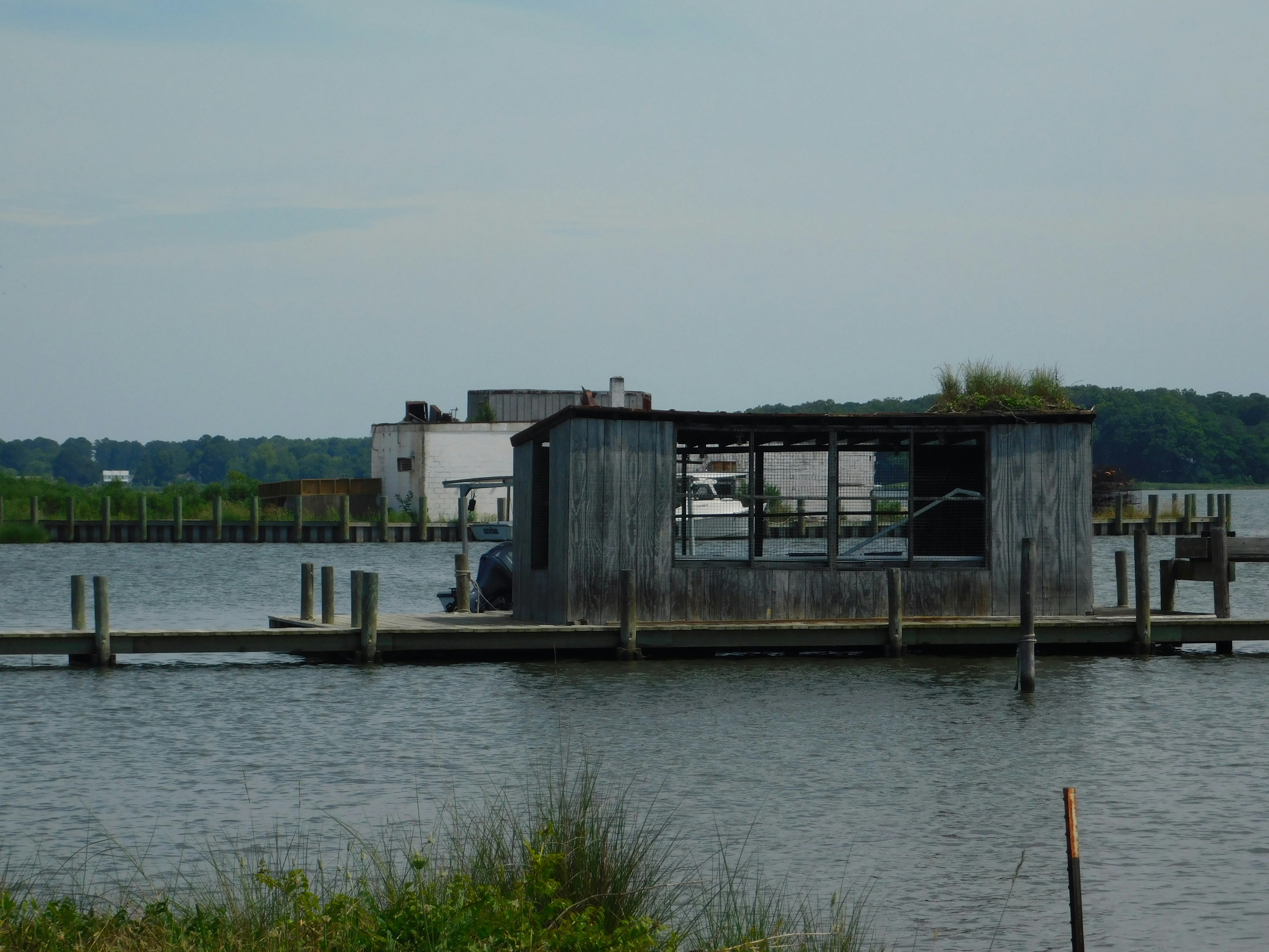 Weathered Boathouse on a Quiet Marina