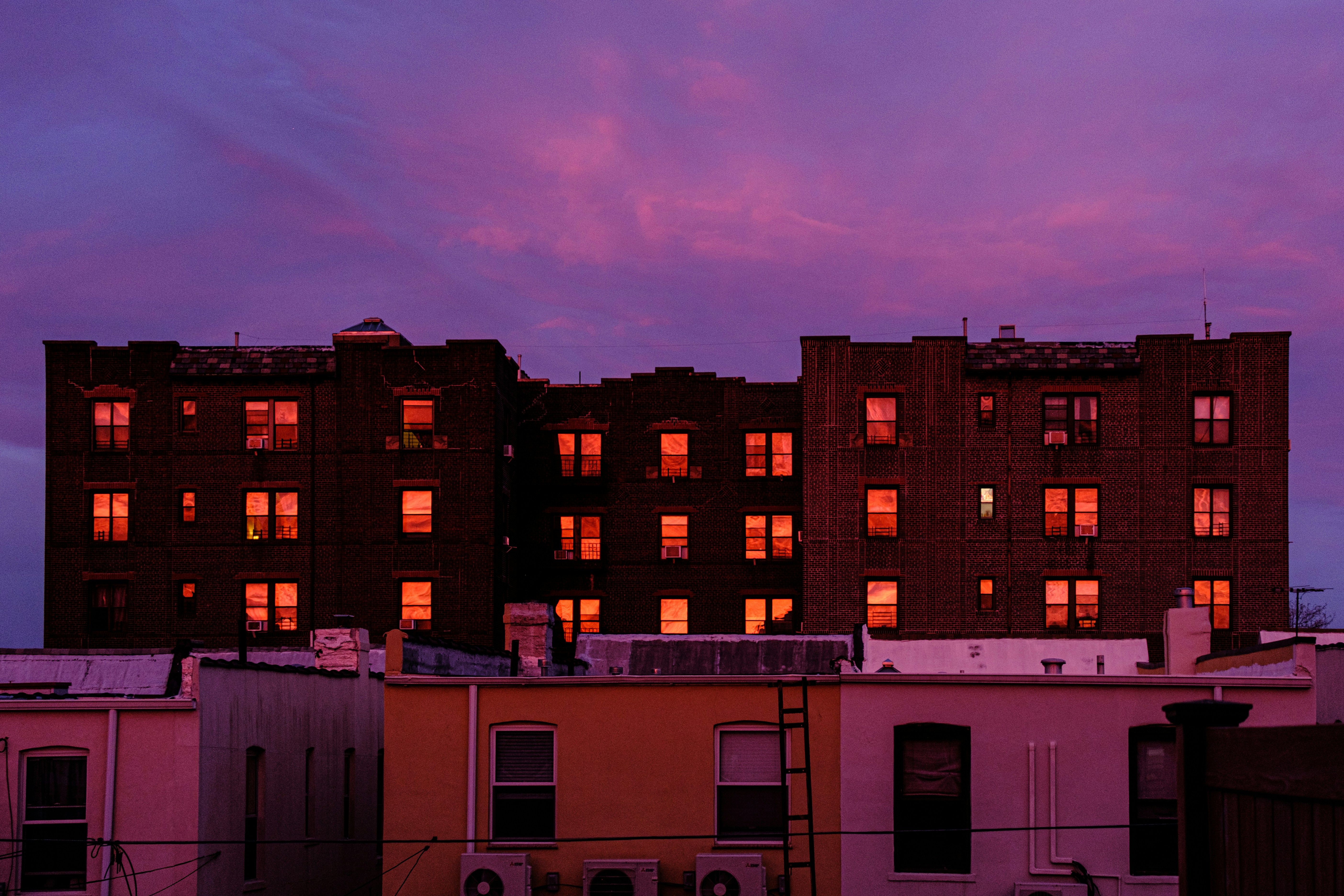 Crimson Sunset Over Rooftop Grid