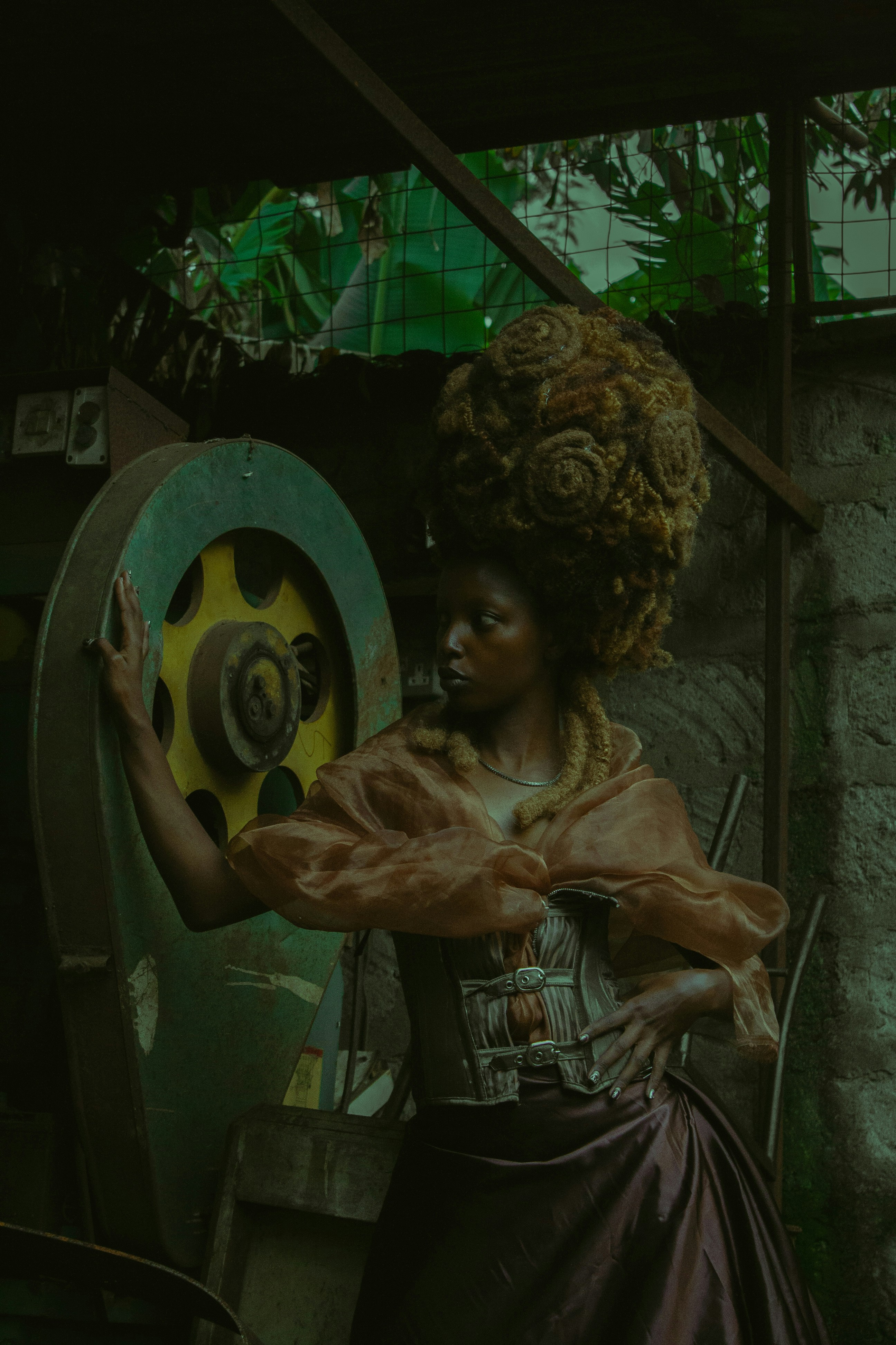 Gears and Velvet: Portrait in a Dim Workshop Light