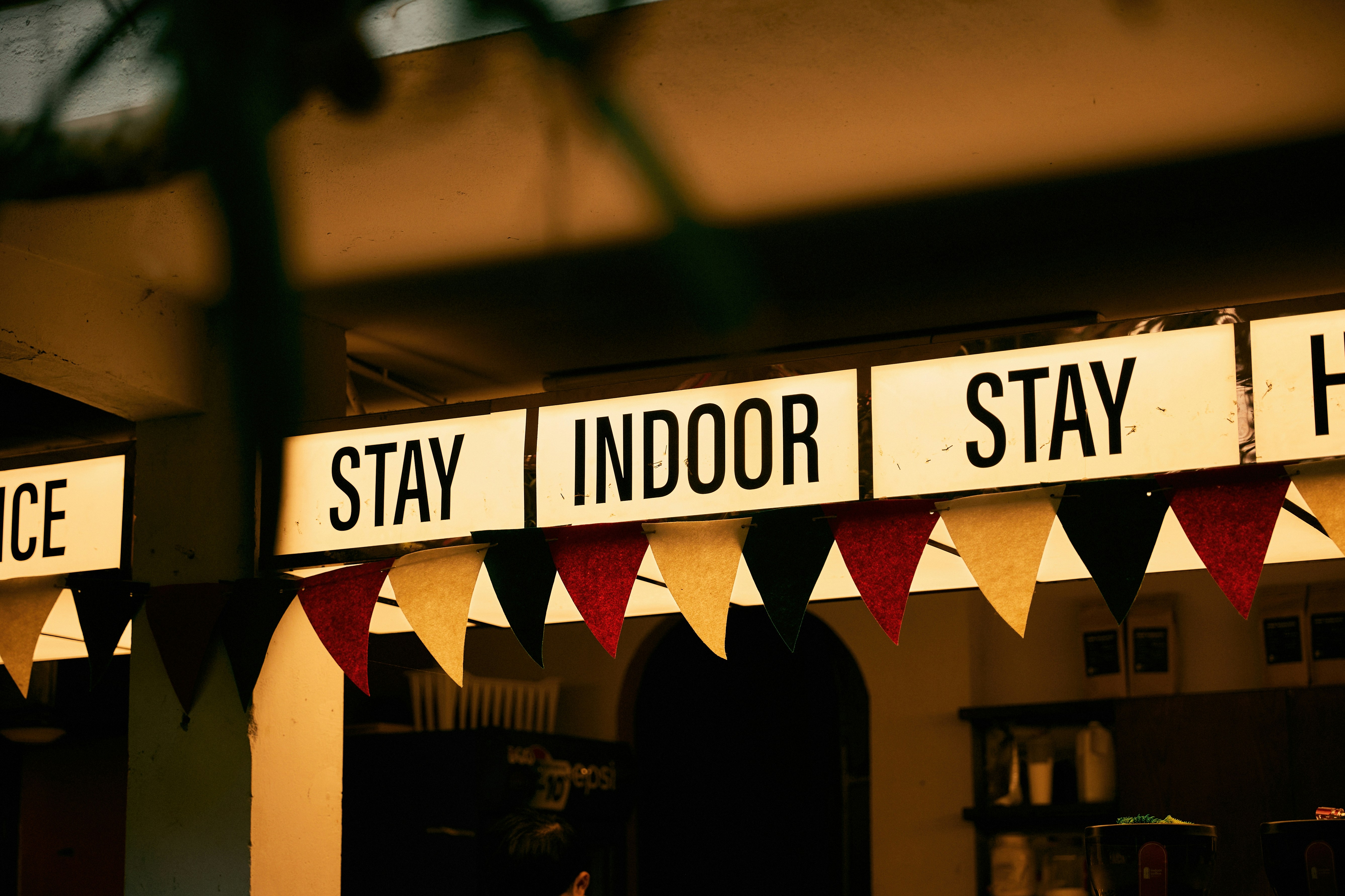 Stay indoor, stay safe signs with decorative flags. photo – Free Cafe ...