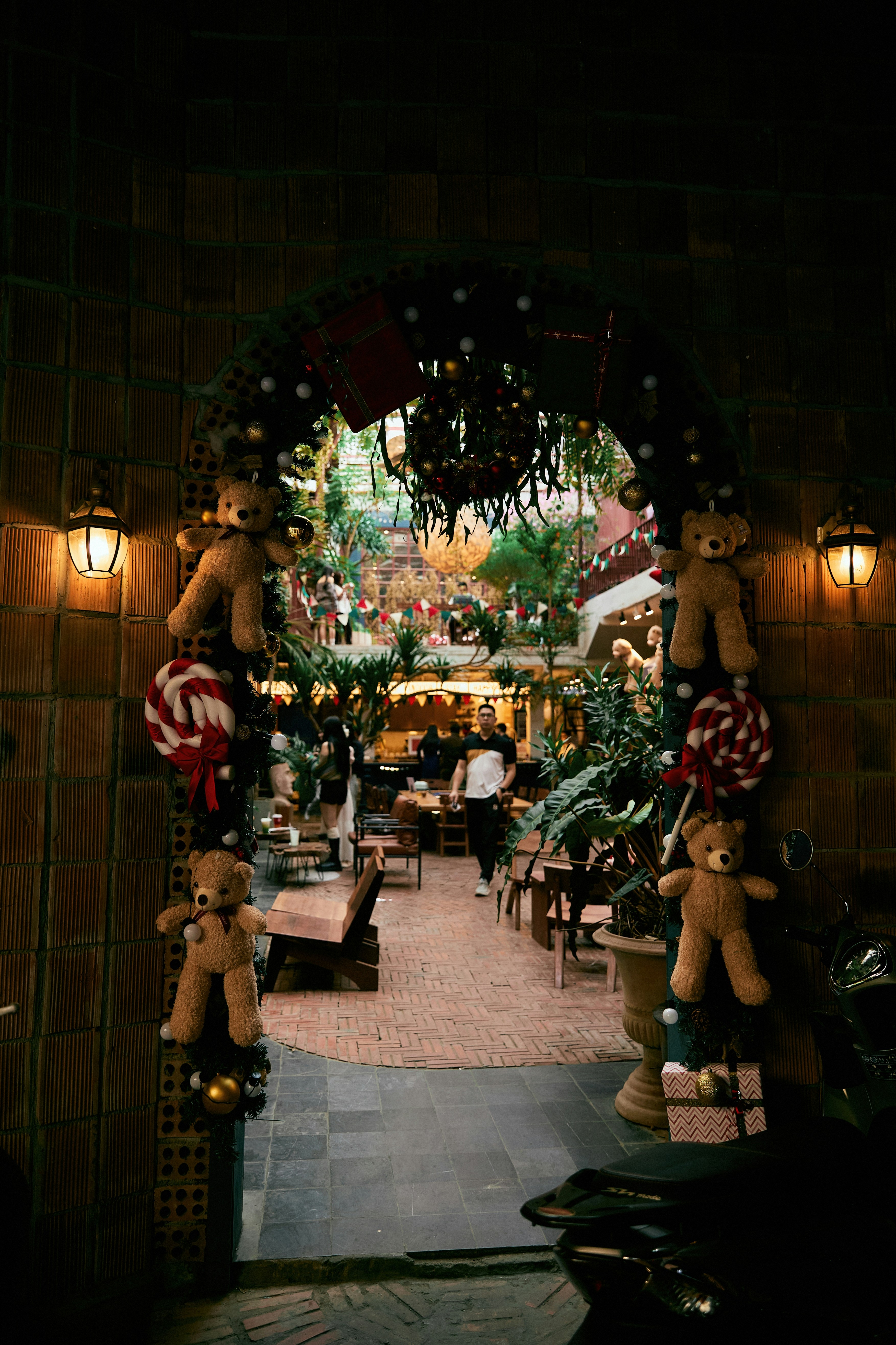 Through the Teddy Archway to a Festive Courtyard Café