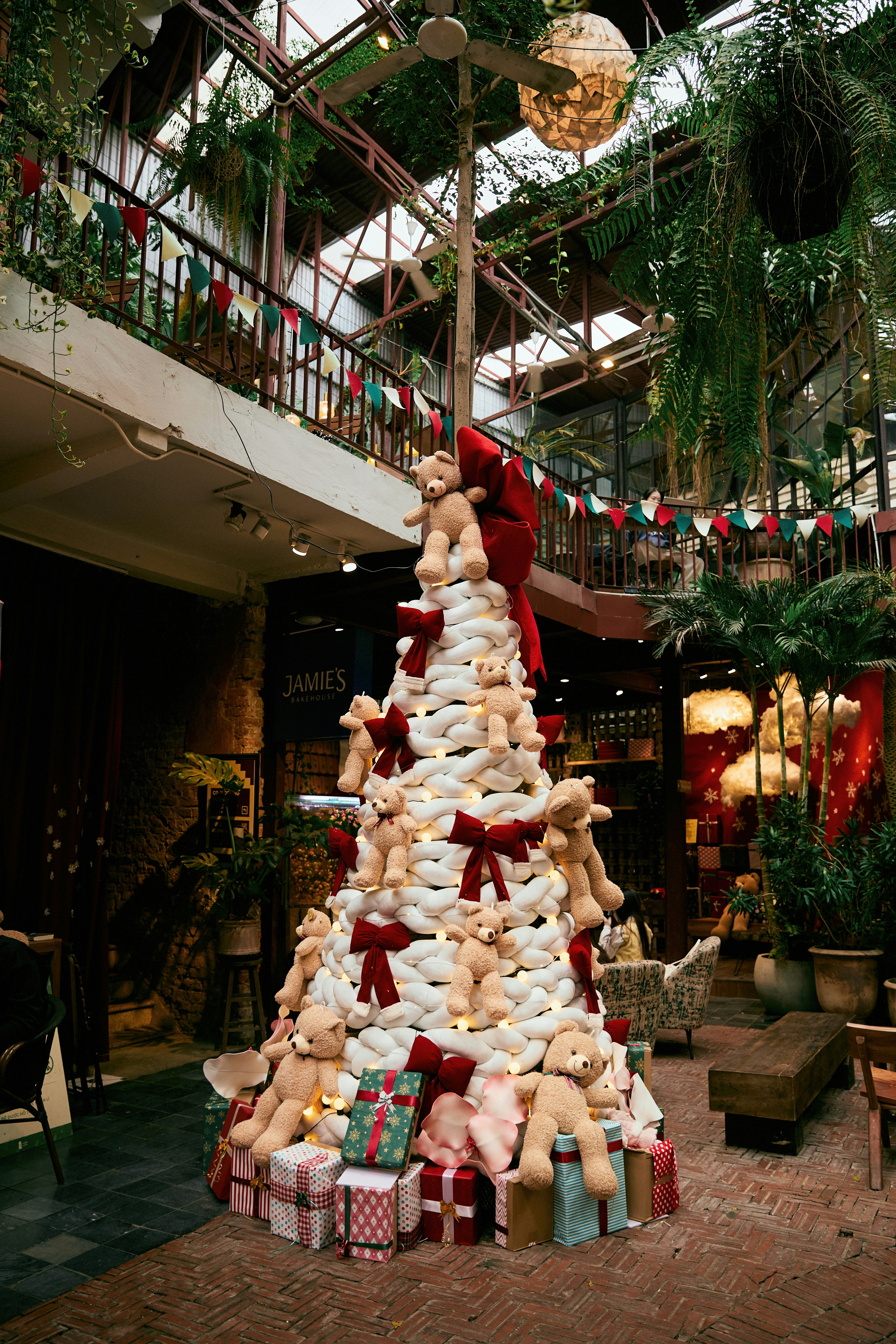 Bear-Stack Christmas Tree in a Sunlit Conservatory