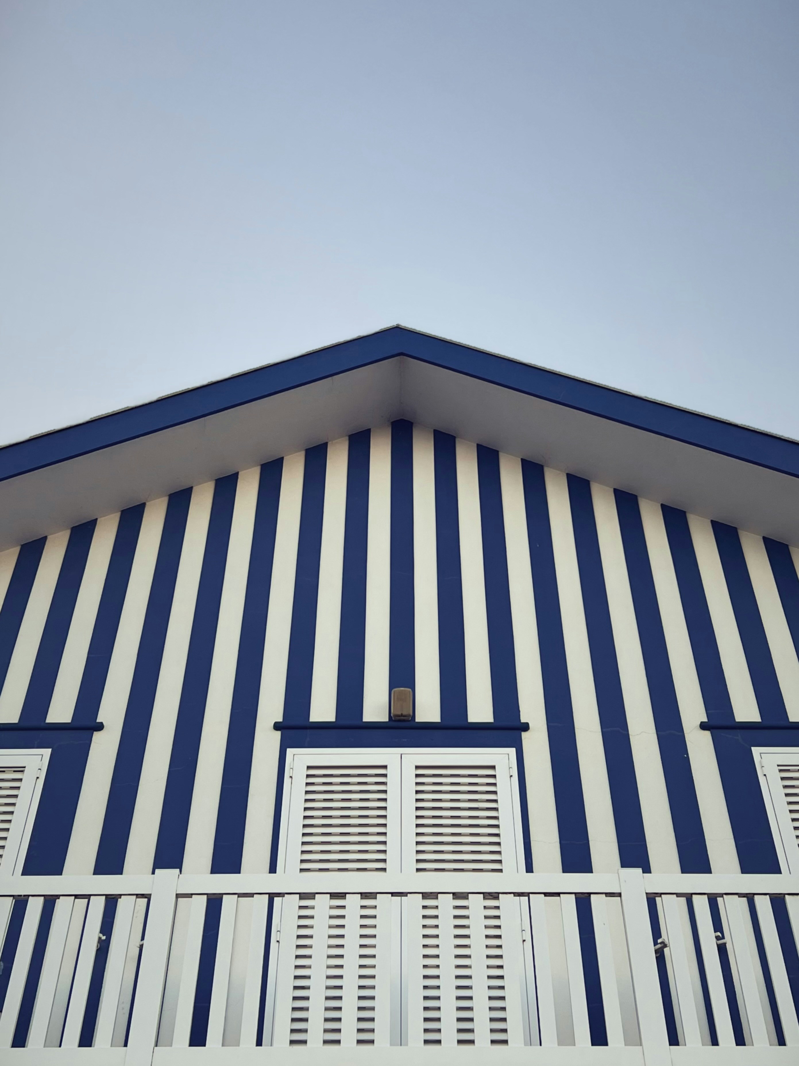 Stripe Summit: The Blue-and-White Facade Reaching Toward a Clear Sky