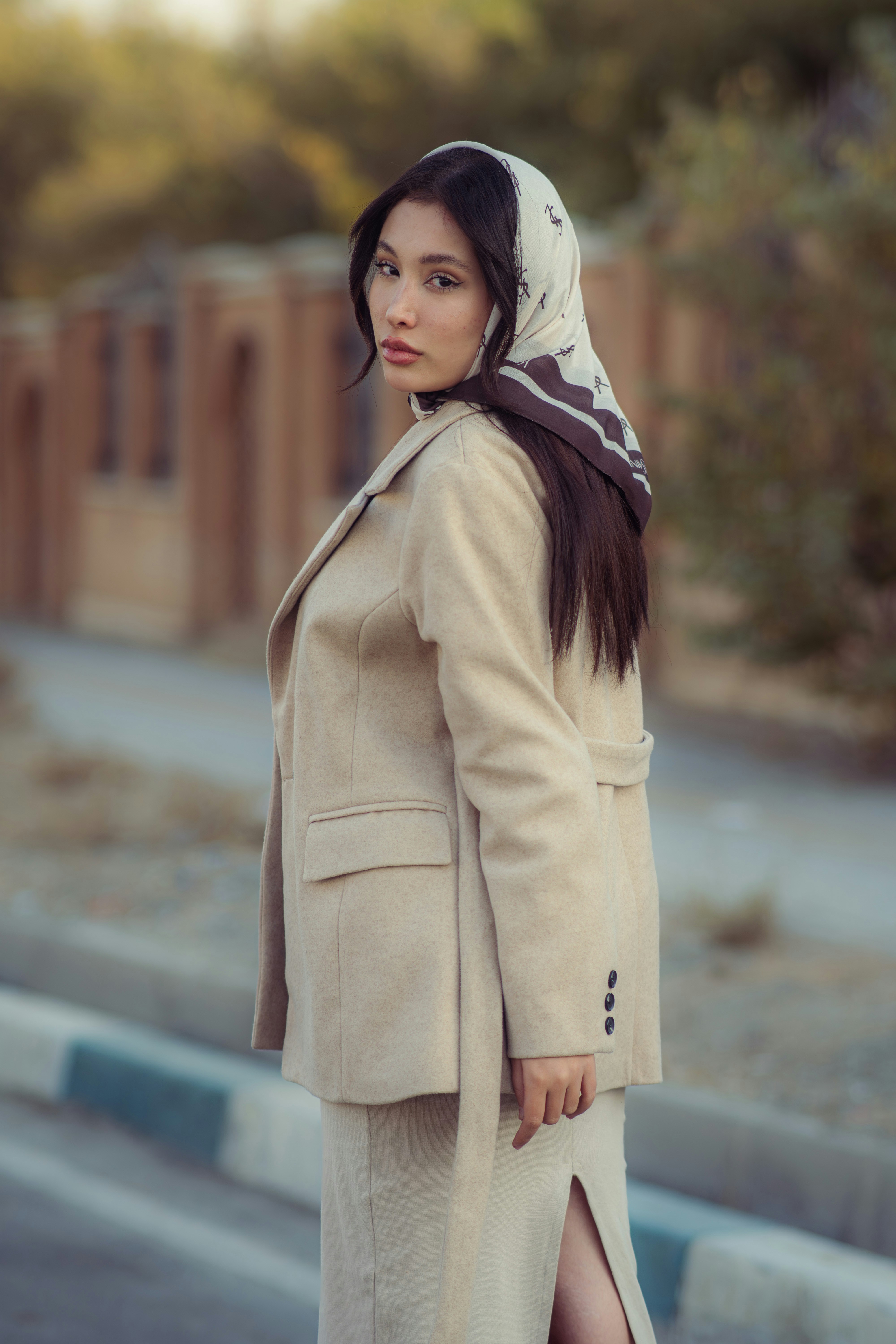 Amber Moments: Portrait of Quiet Confidence in a Beige Coat