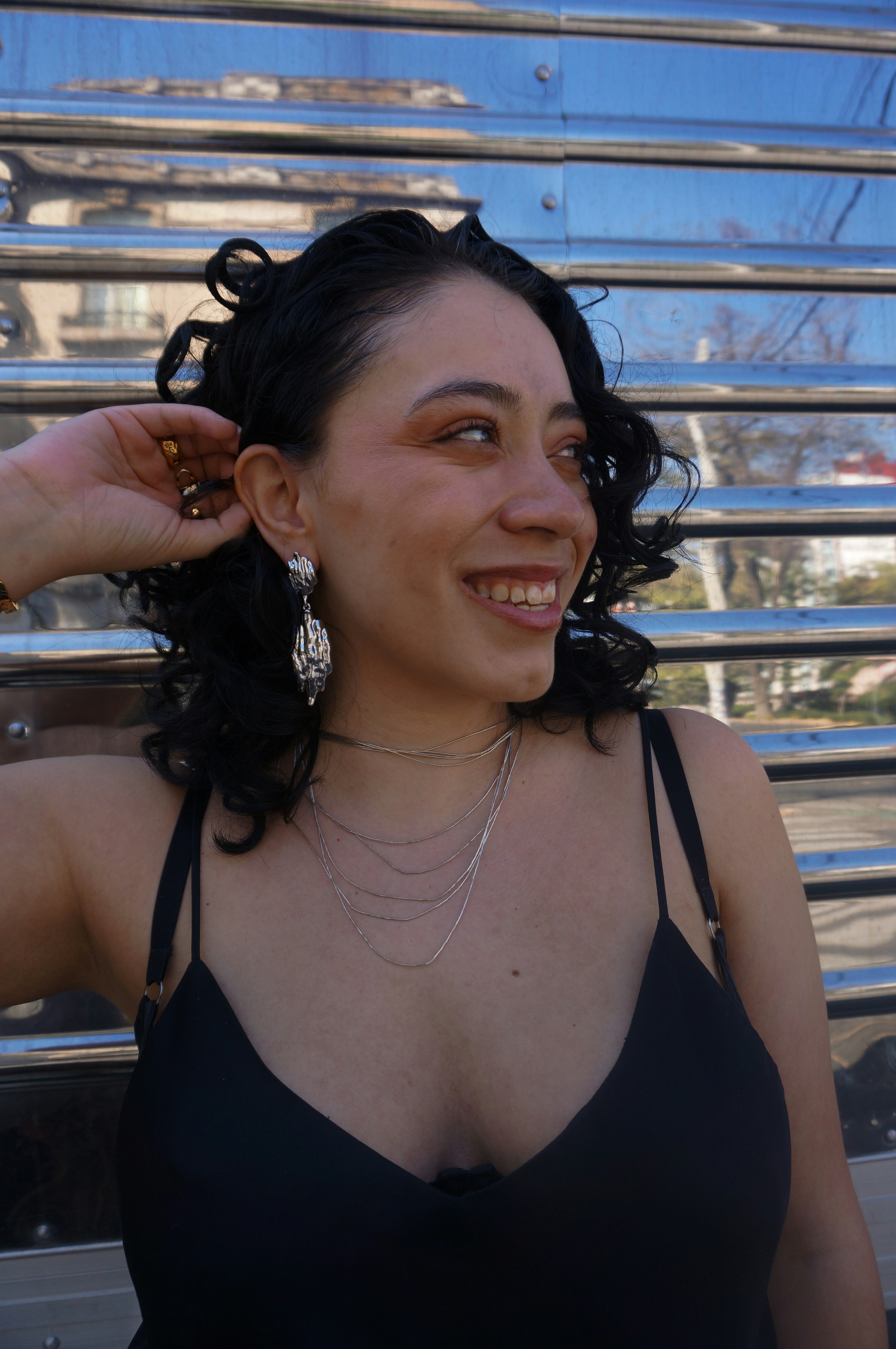 Smiling in the Rails: Portrait with Chrome Reflections