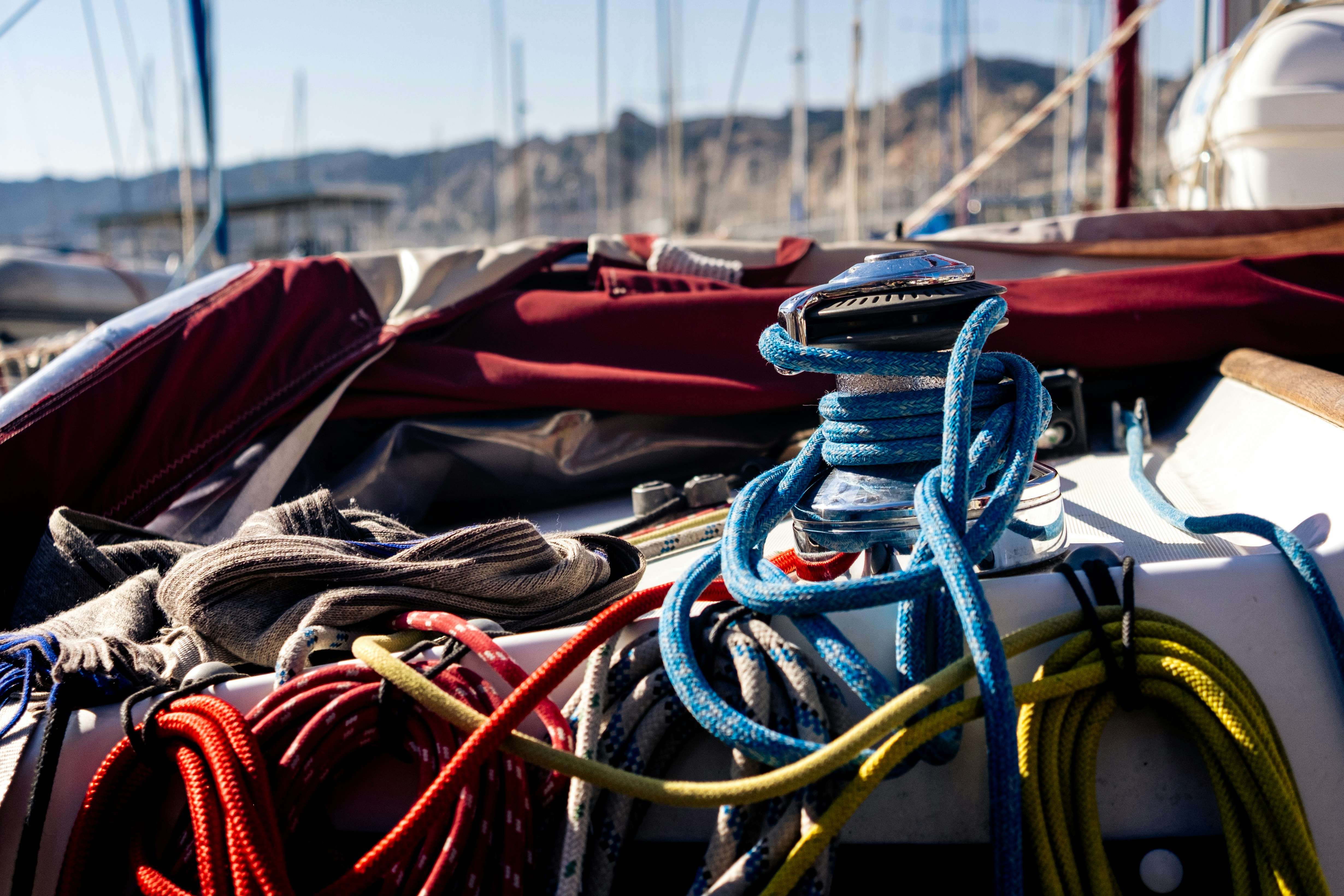 Blue Cordage at the Winch: A Close-Up Portrait of Sailboat Tension