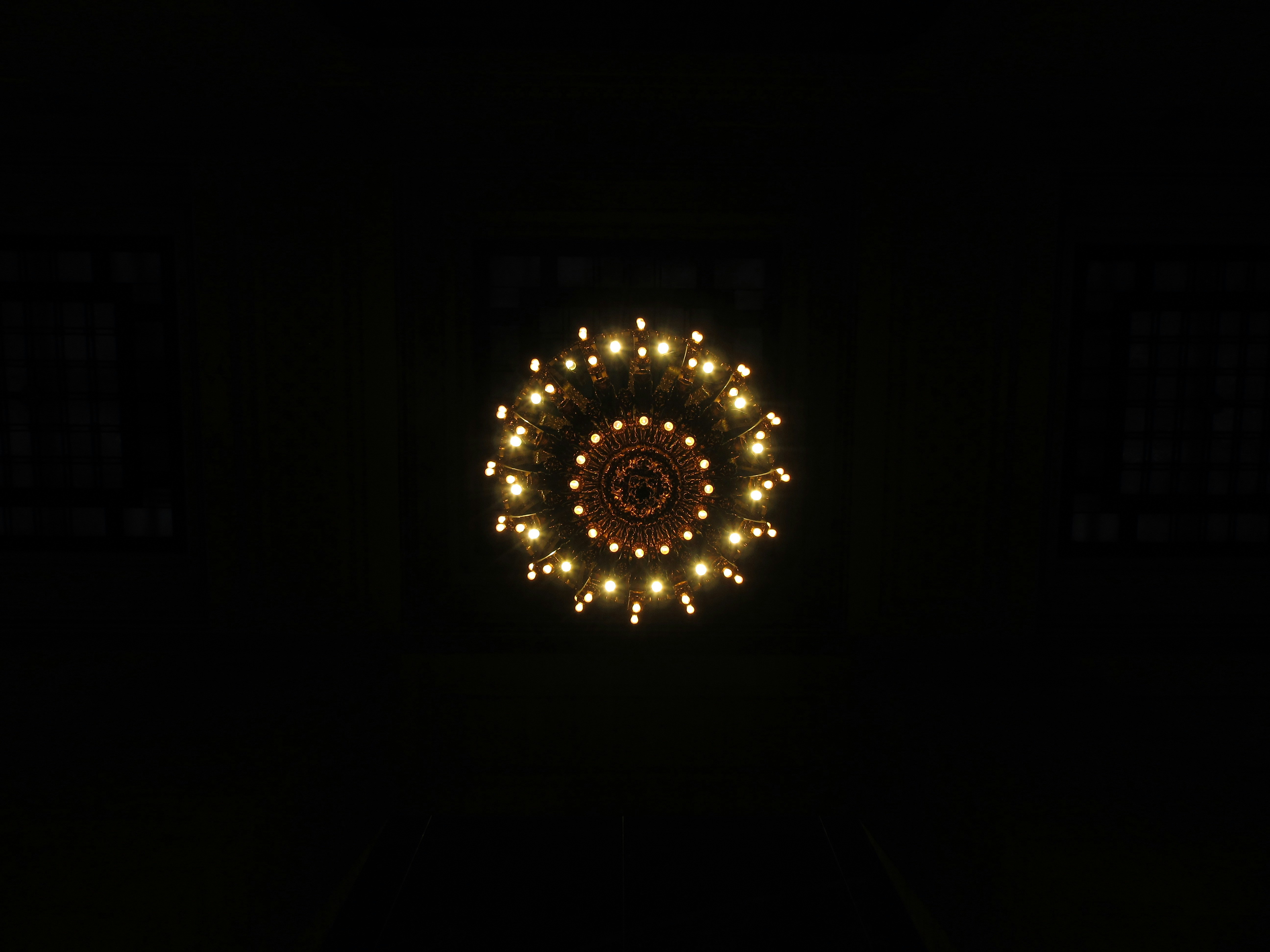 Low ISO photo of a chandelier hanging overhead