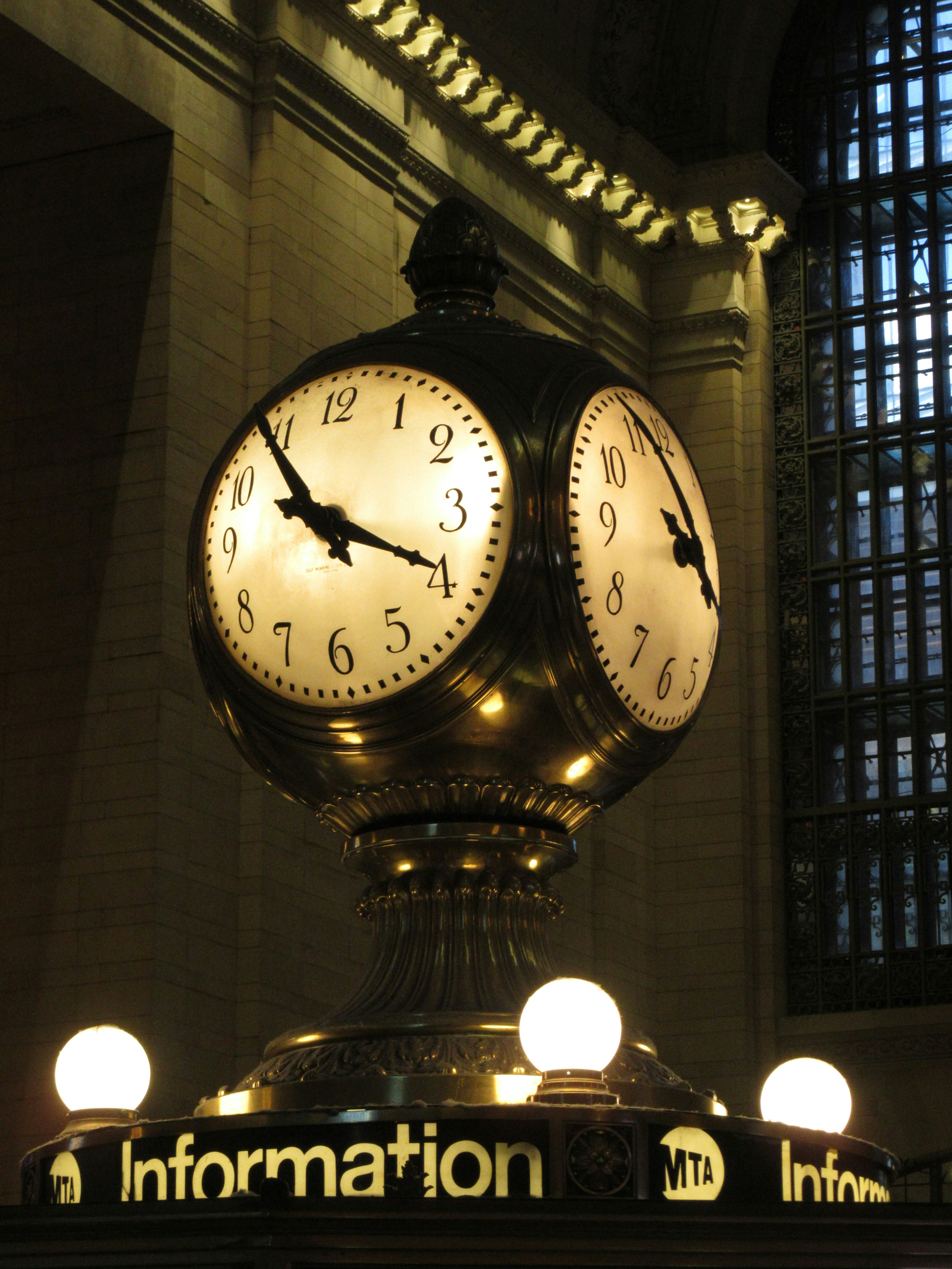A close-up of a clock in the middle of Penn Station