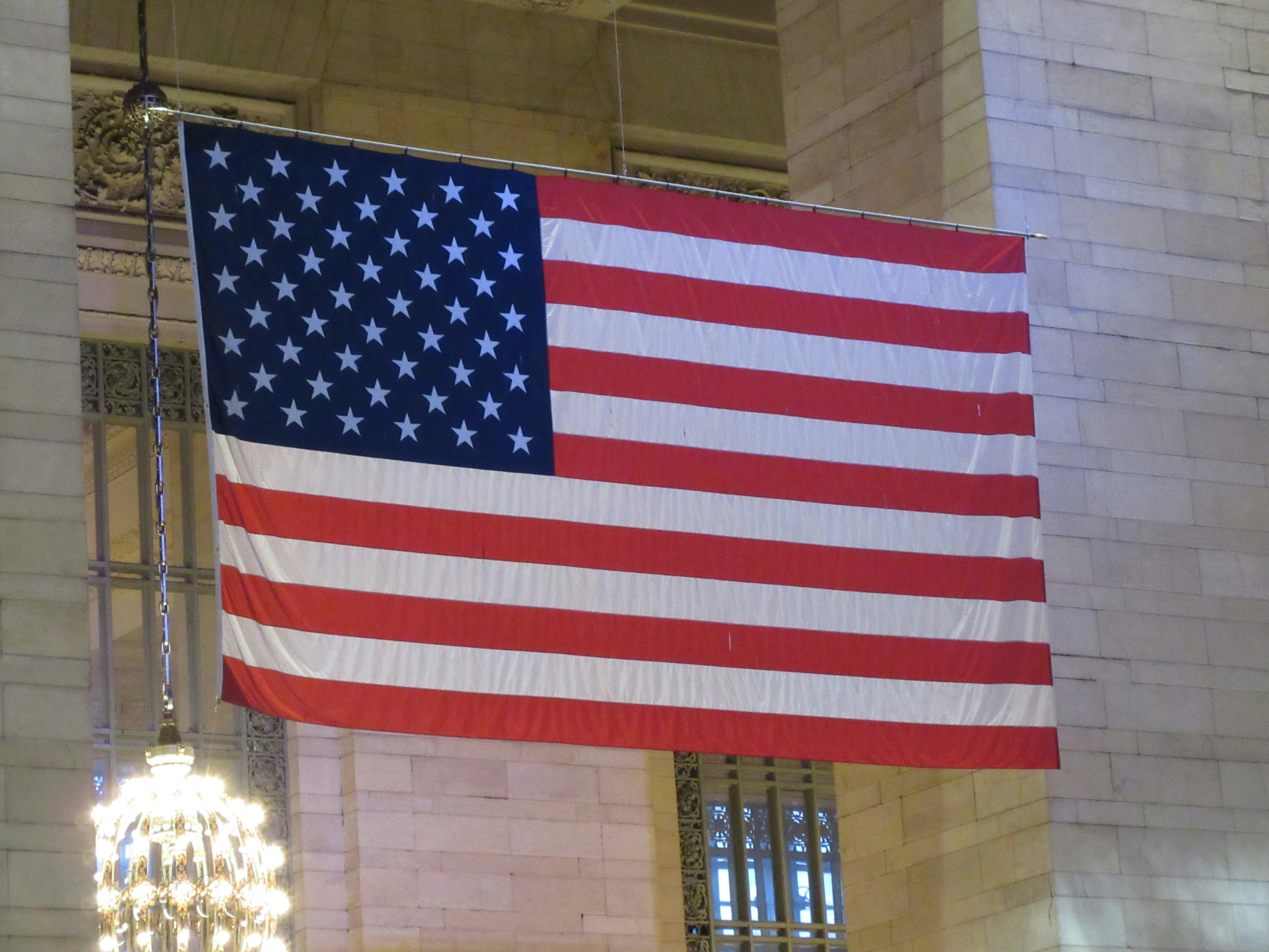 An American flag hanging in Penn Station