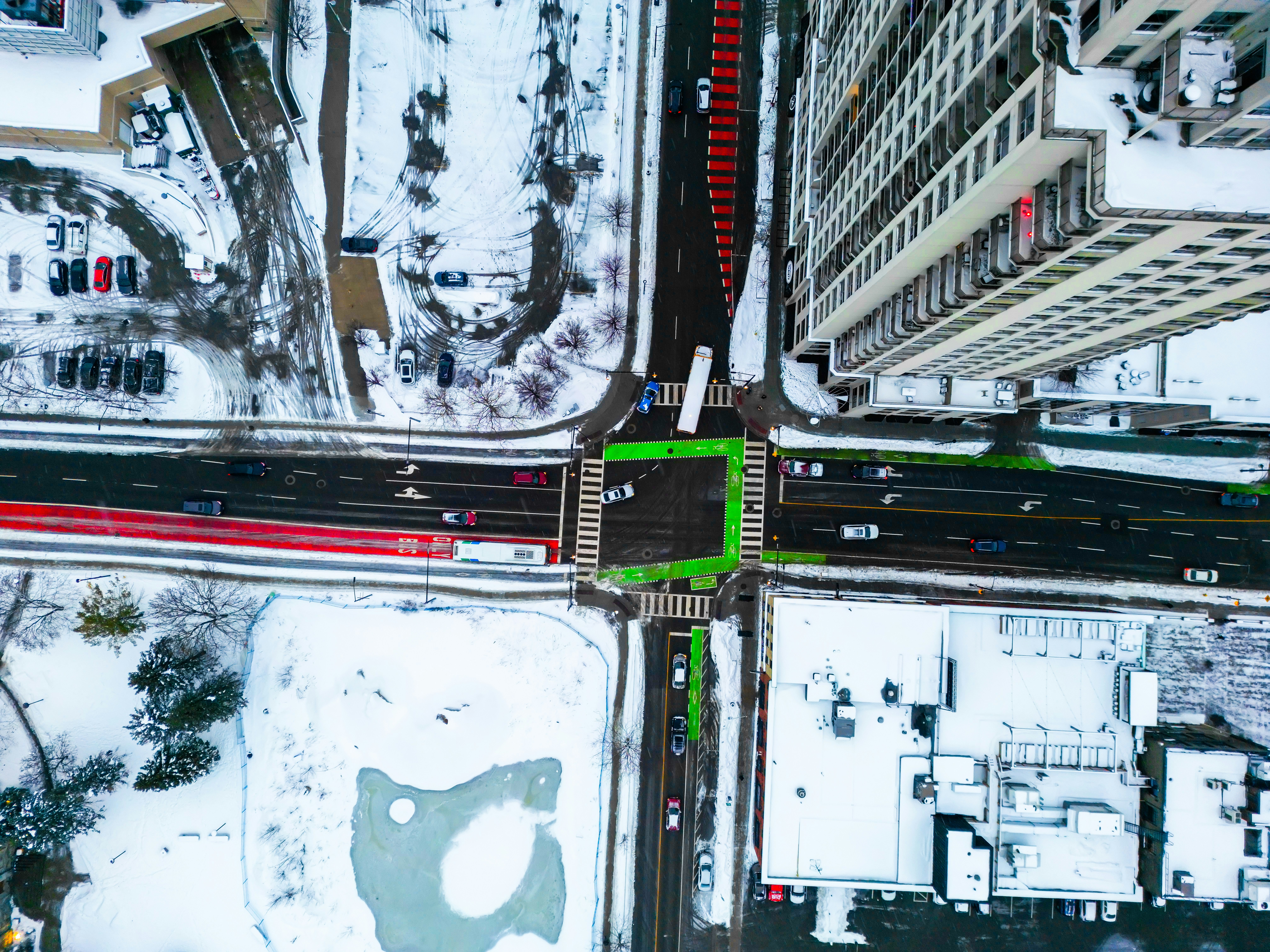 Neon Green Crosswalk at a Snowbound City Intersection