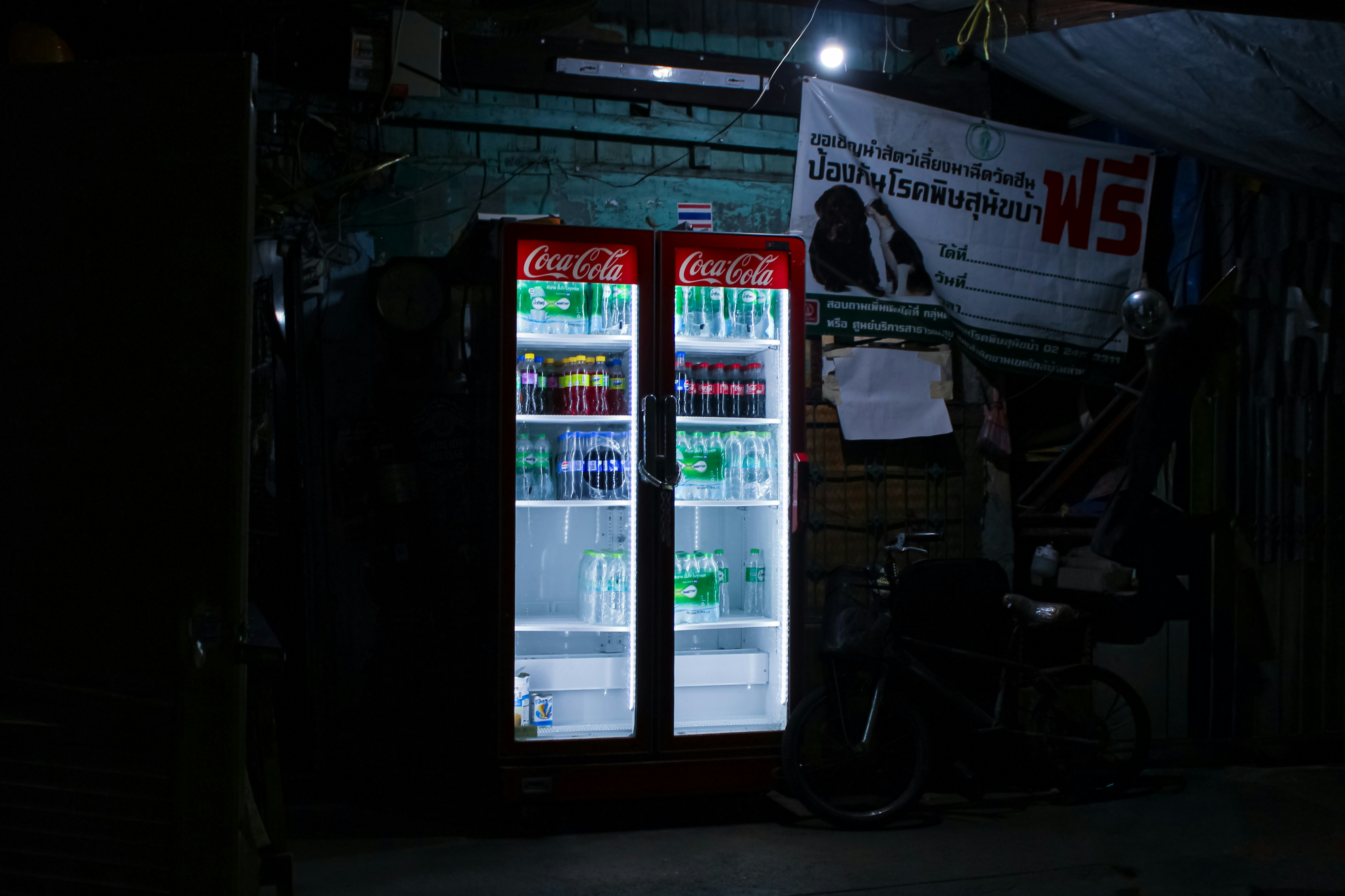 Night Bargain: Coca-Cola Fridges Glow in a Quiet Street Corner