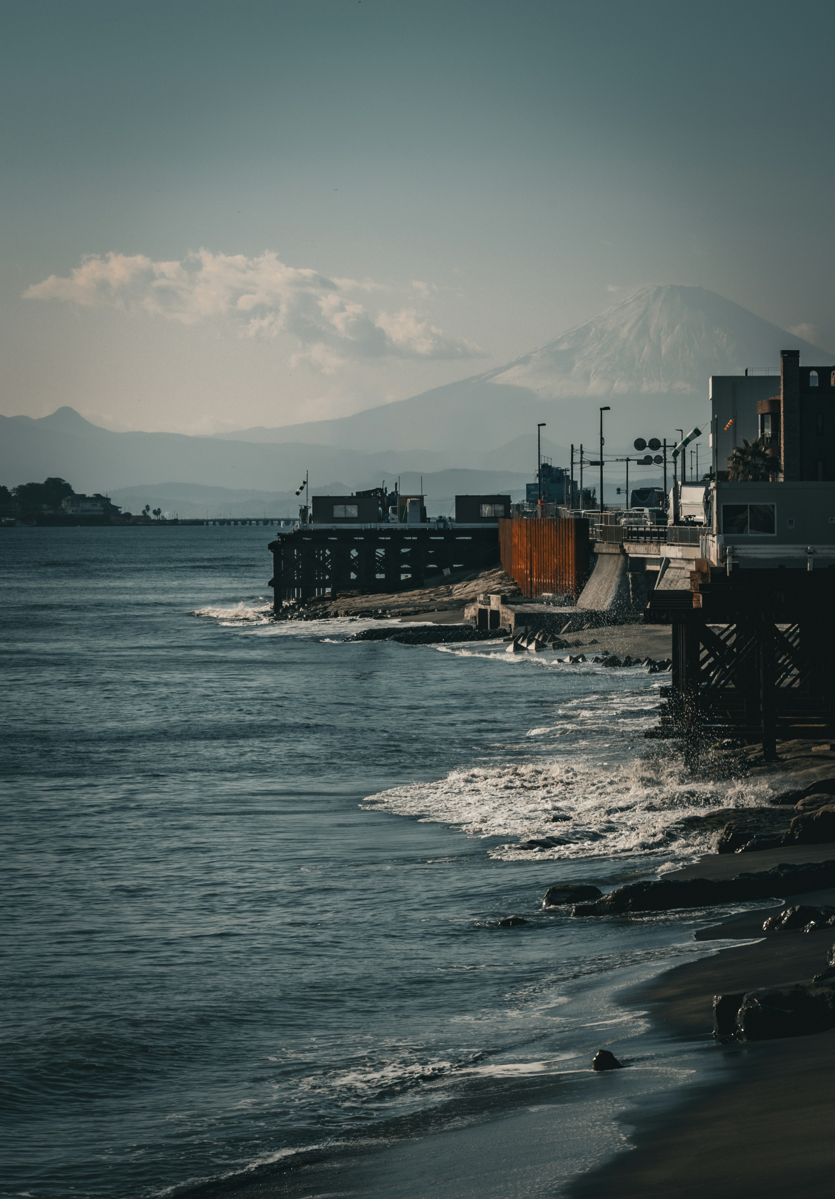 Harbor Silence: Pier, Ocean, and a Distant Volcano