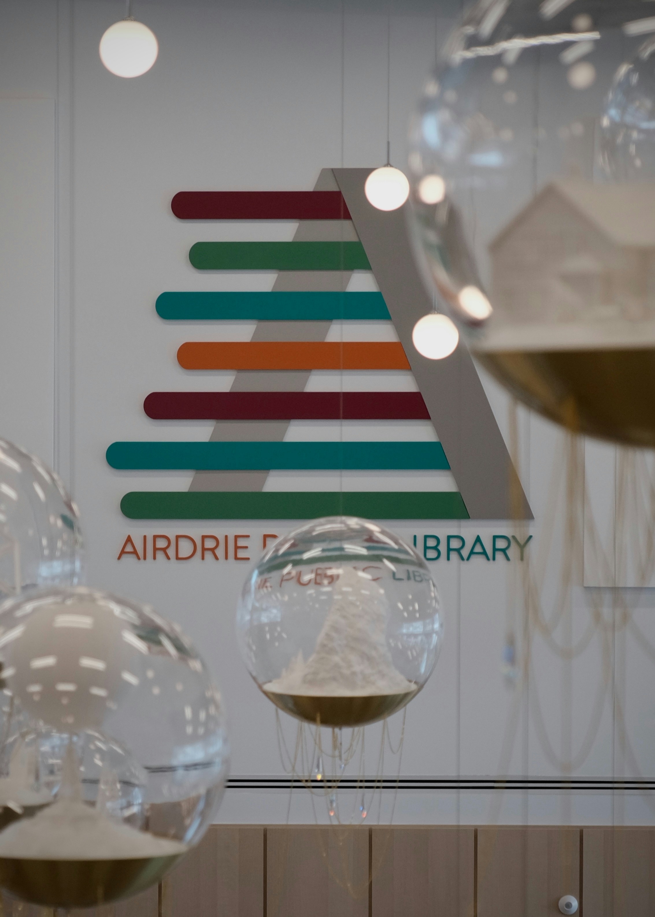 Beaded Colors over a Library Logo