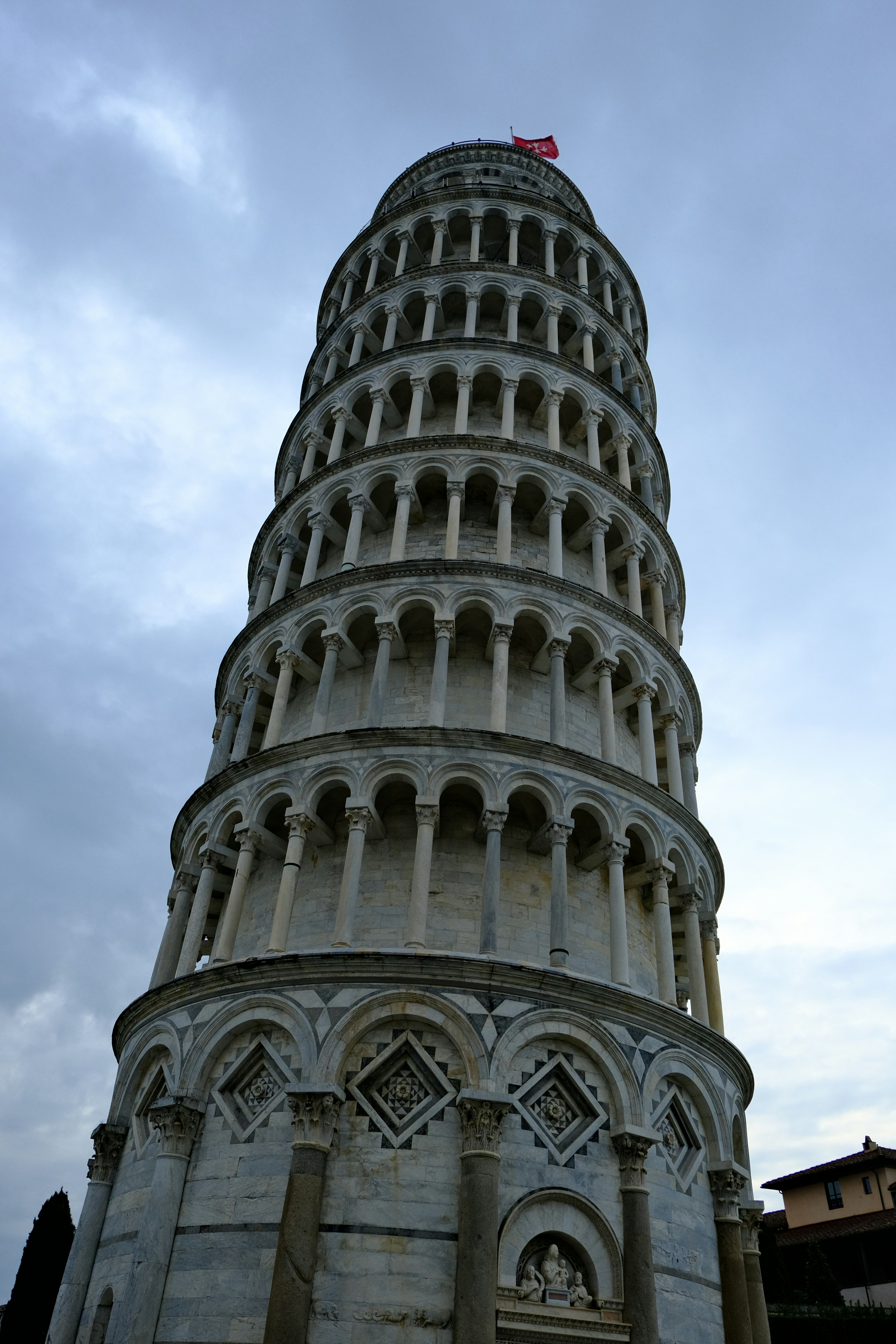 The Leaning Marble Spire: Pisa's Tower Against a Clear Sky