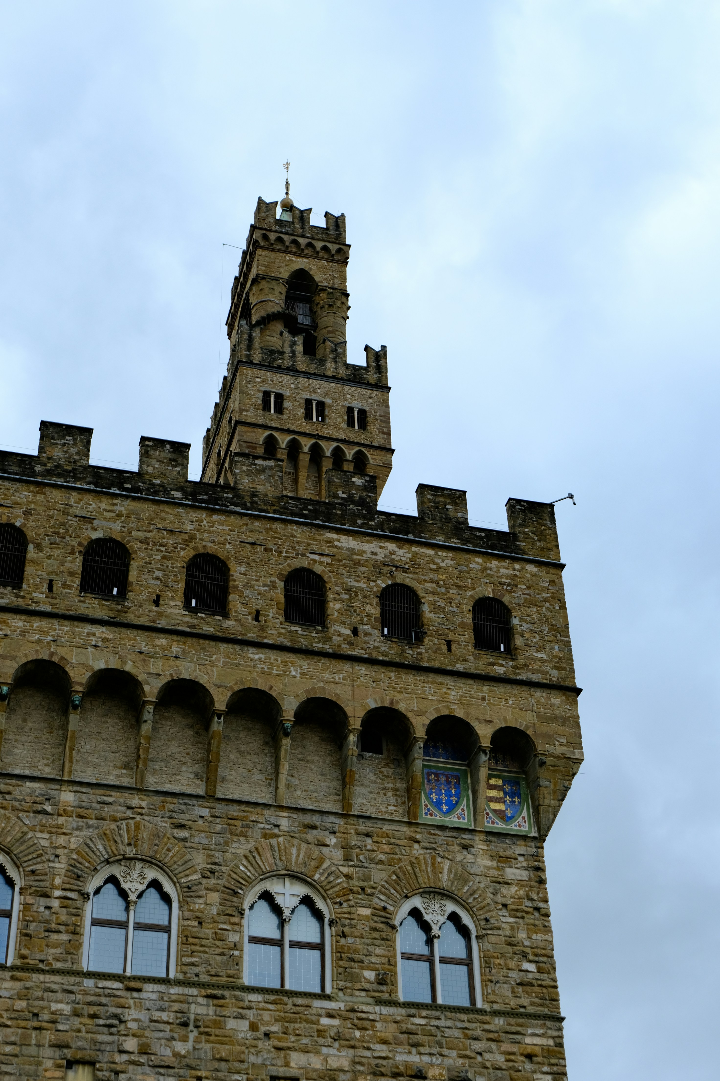 Castle Tower Rising Above Carved Arches