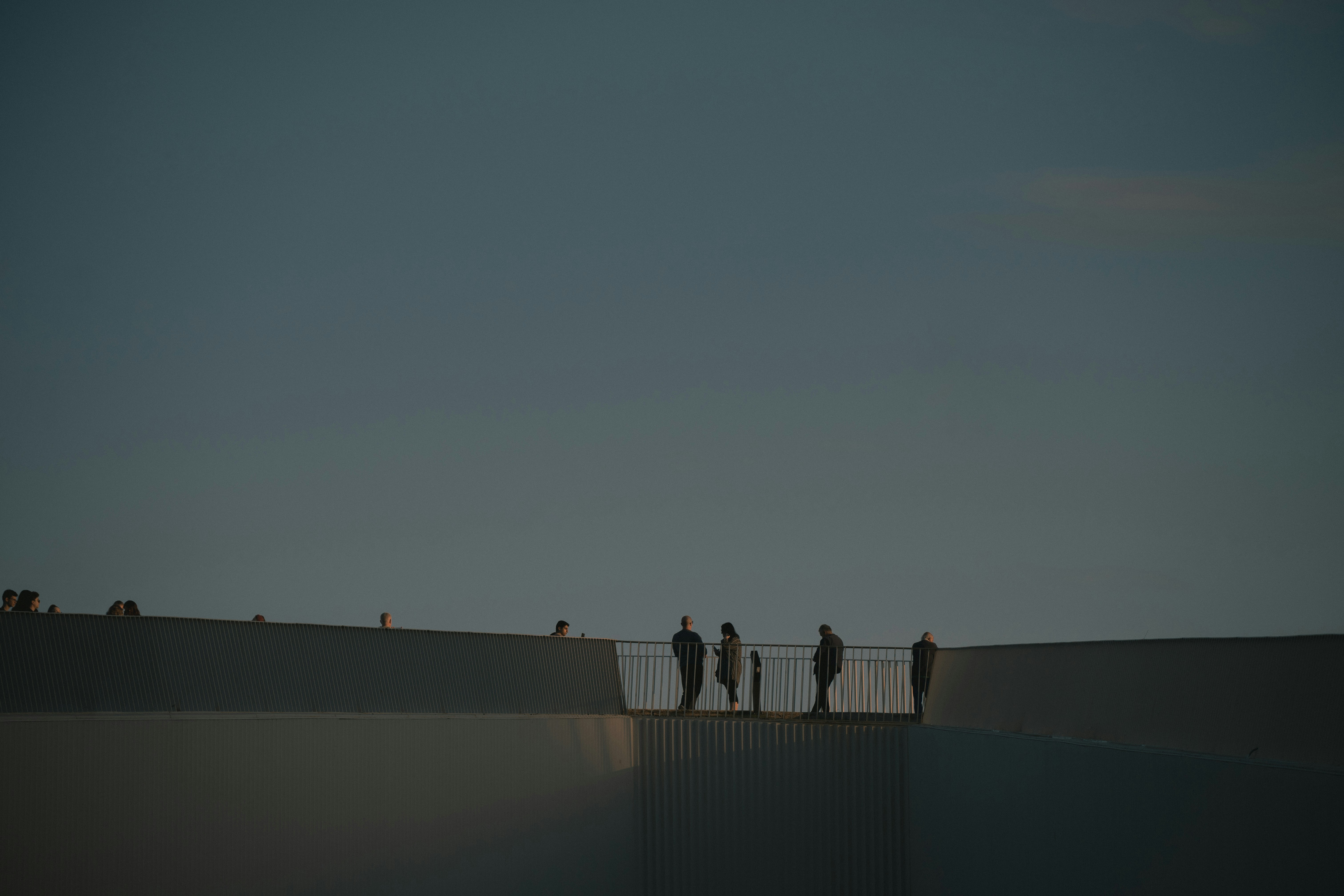 Edge of Light: Figures on a Silent Bridge