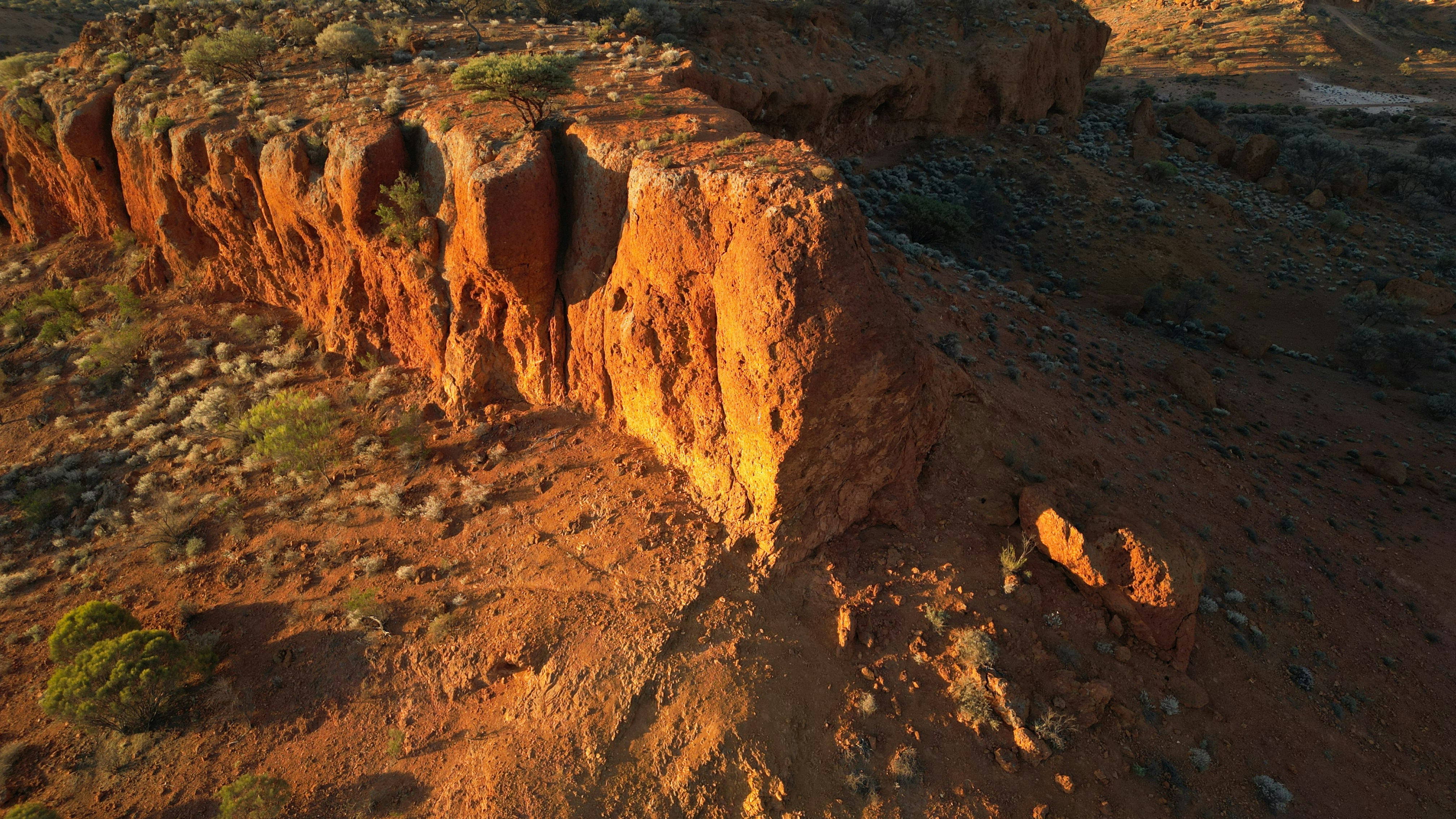 Sunlit Red Cliffs: Echoes of Weathered Rock in Desert Light