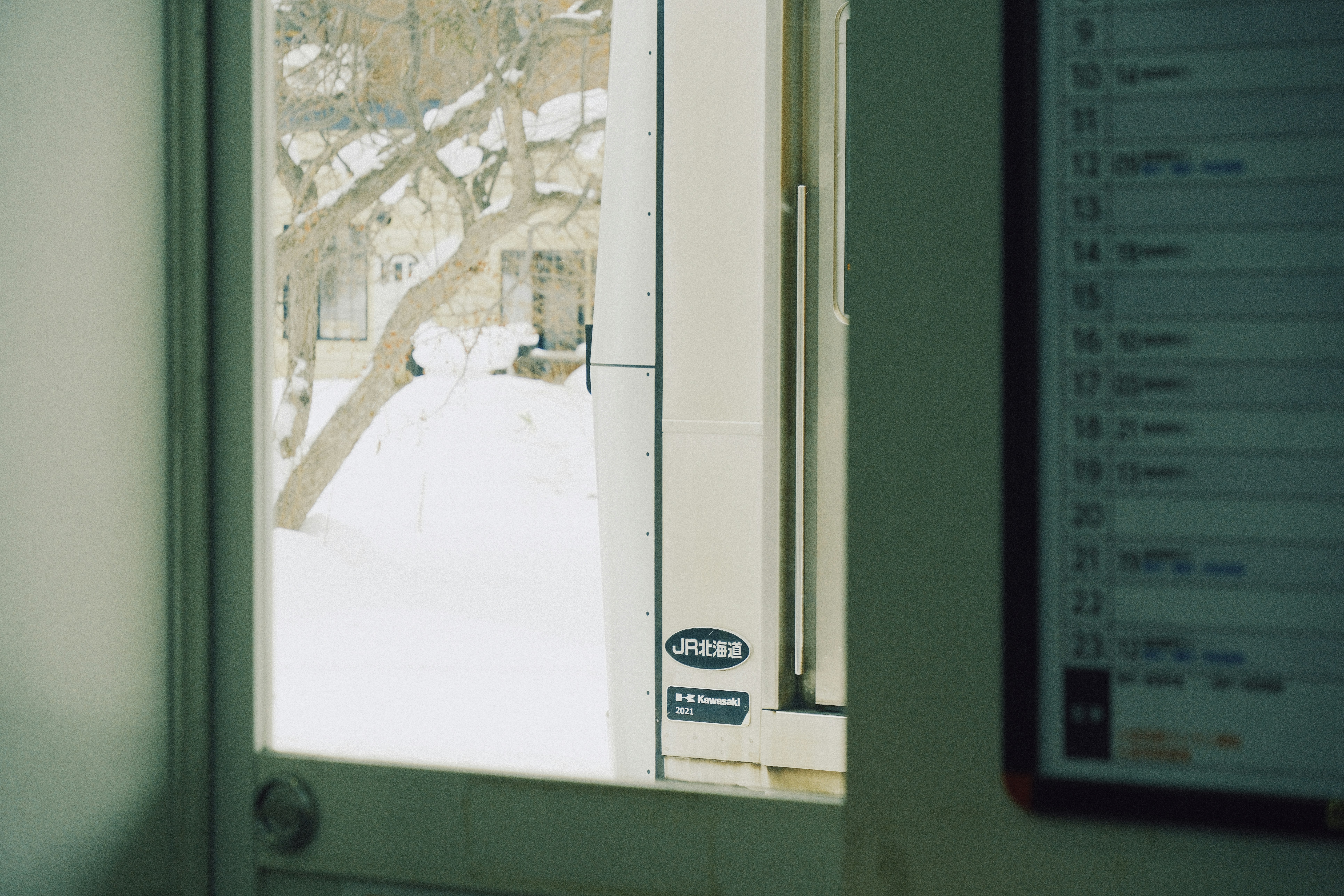 Snowy trees visible through a window with a calendar. photo – Free ...