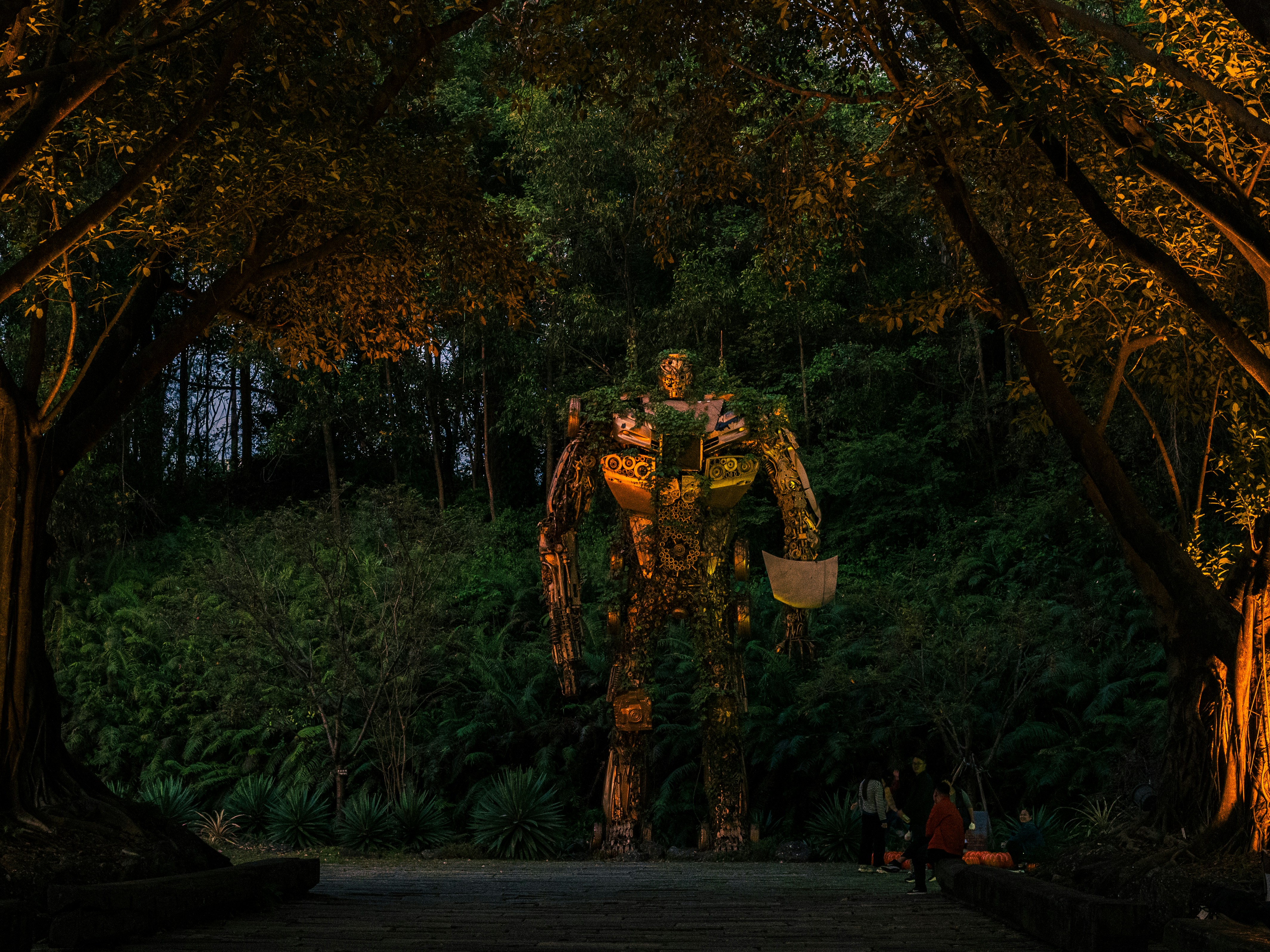 Golden robot statue in a forest setting photo – Free Trees Image on ...