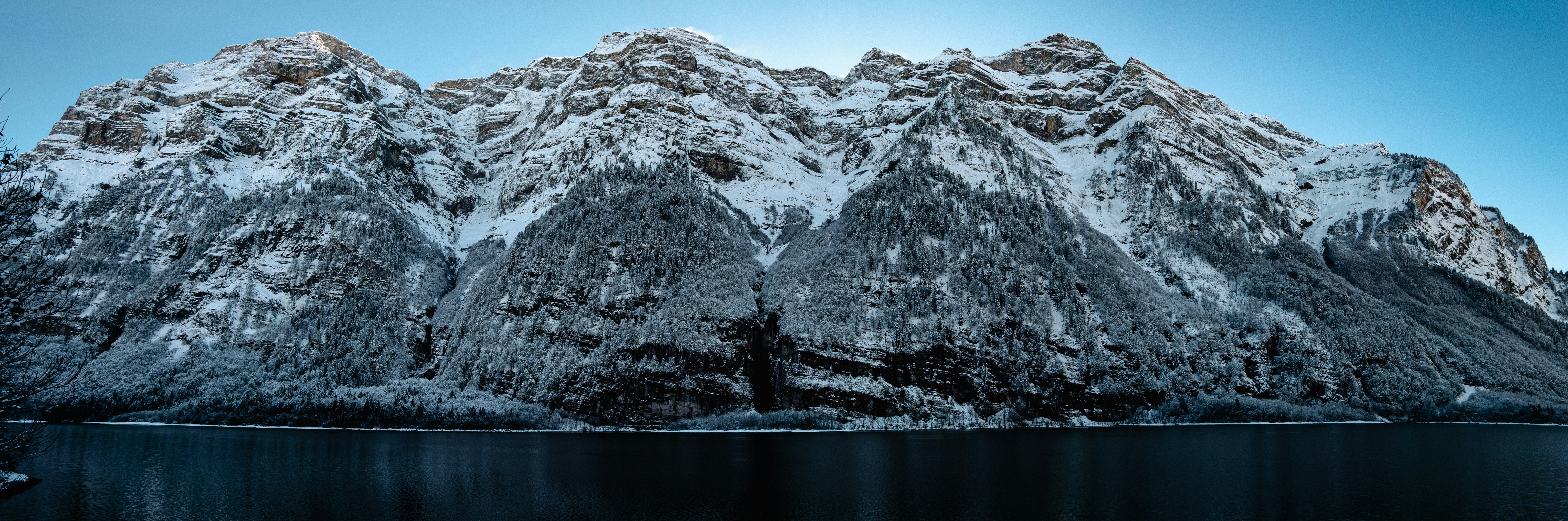 Snow-capped Peaks Fringed by a Quiet Lake