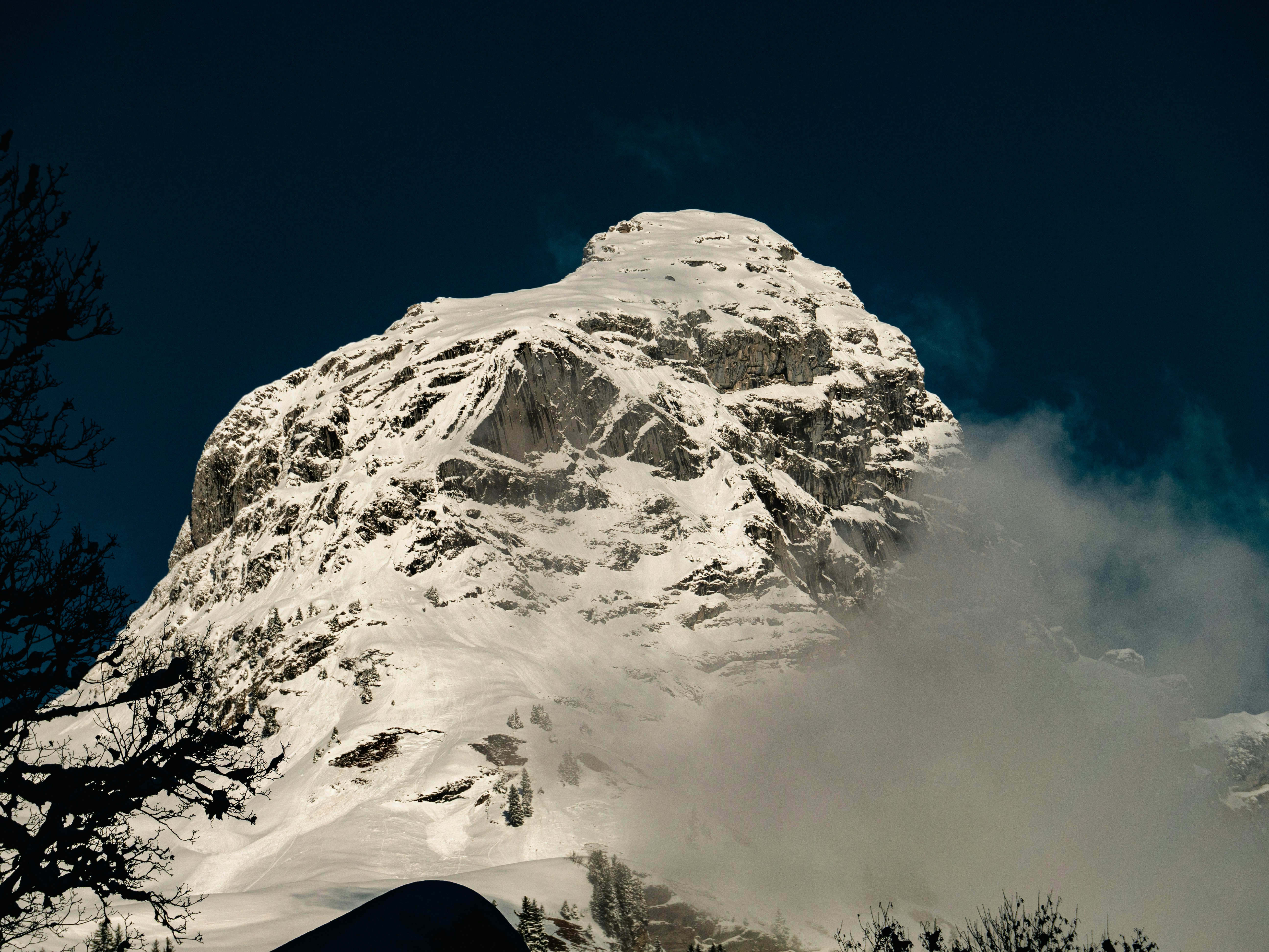 Snow-Crowned Peak Piercing a Narrow Sky