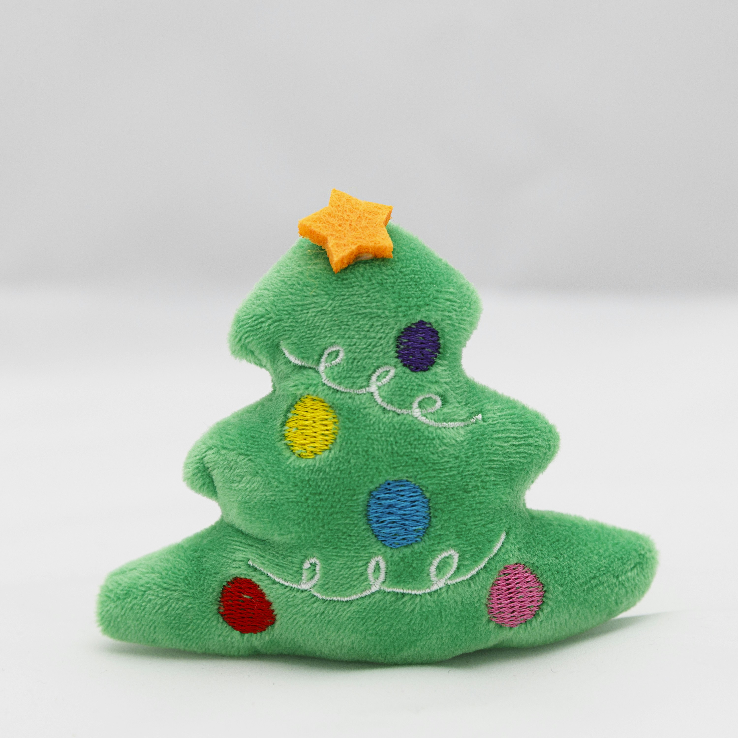 Tiny Christmas Tree Plush: A Soft Star on a White Stage