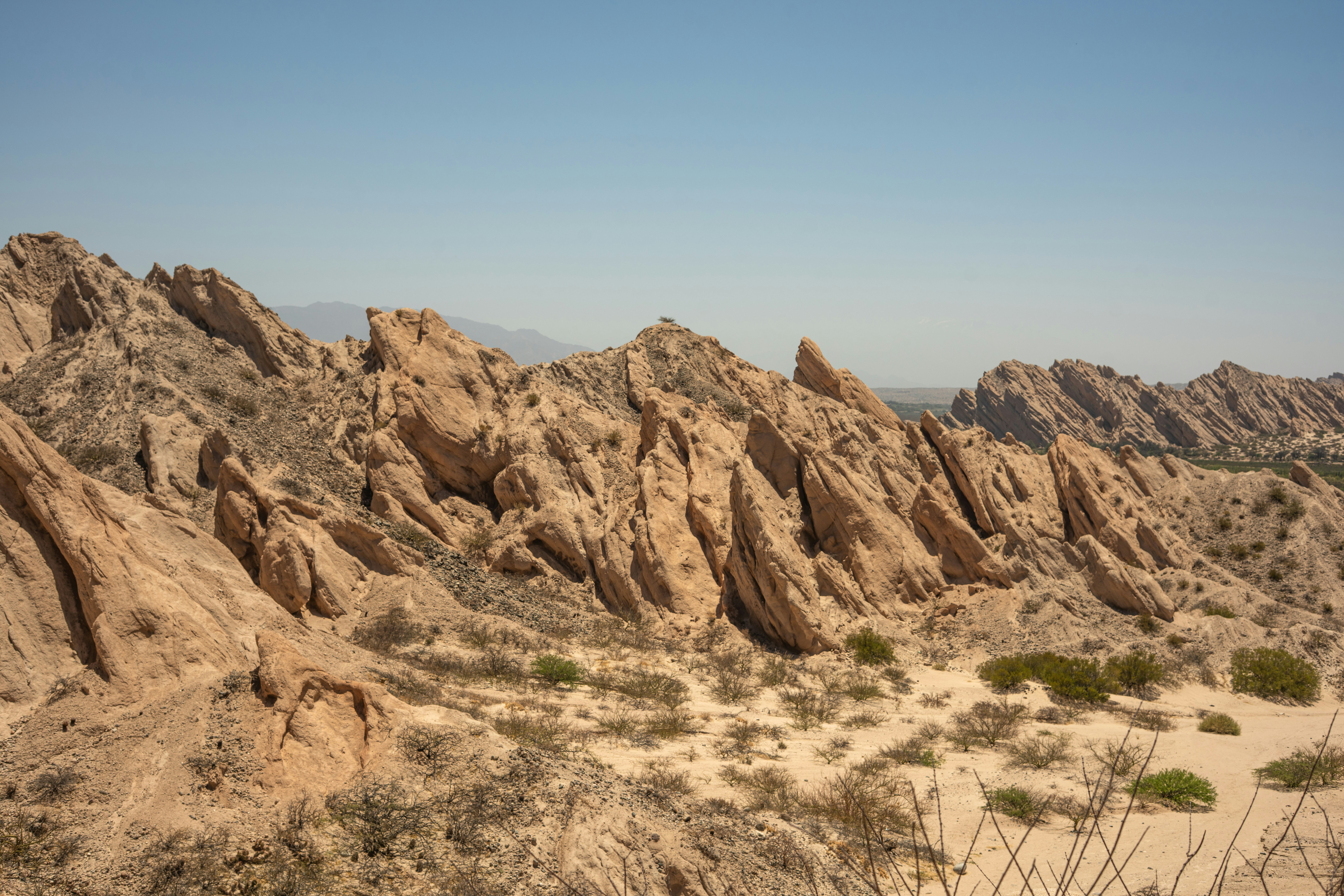 Desert Cathedral: Weathered Peaks Rising from Sand and Sage