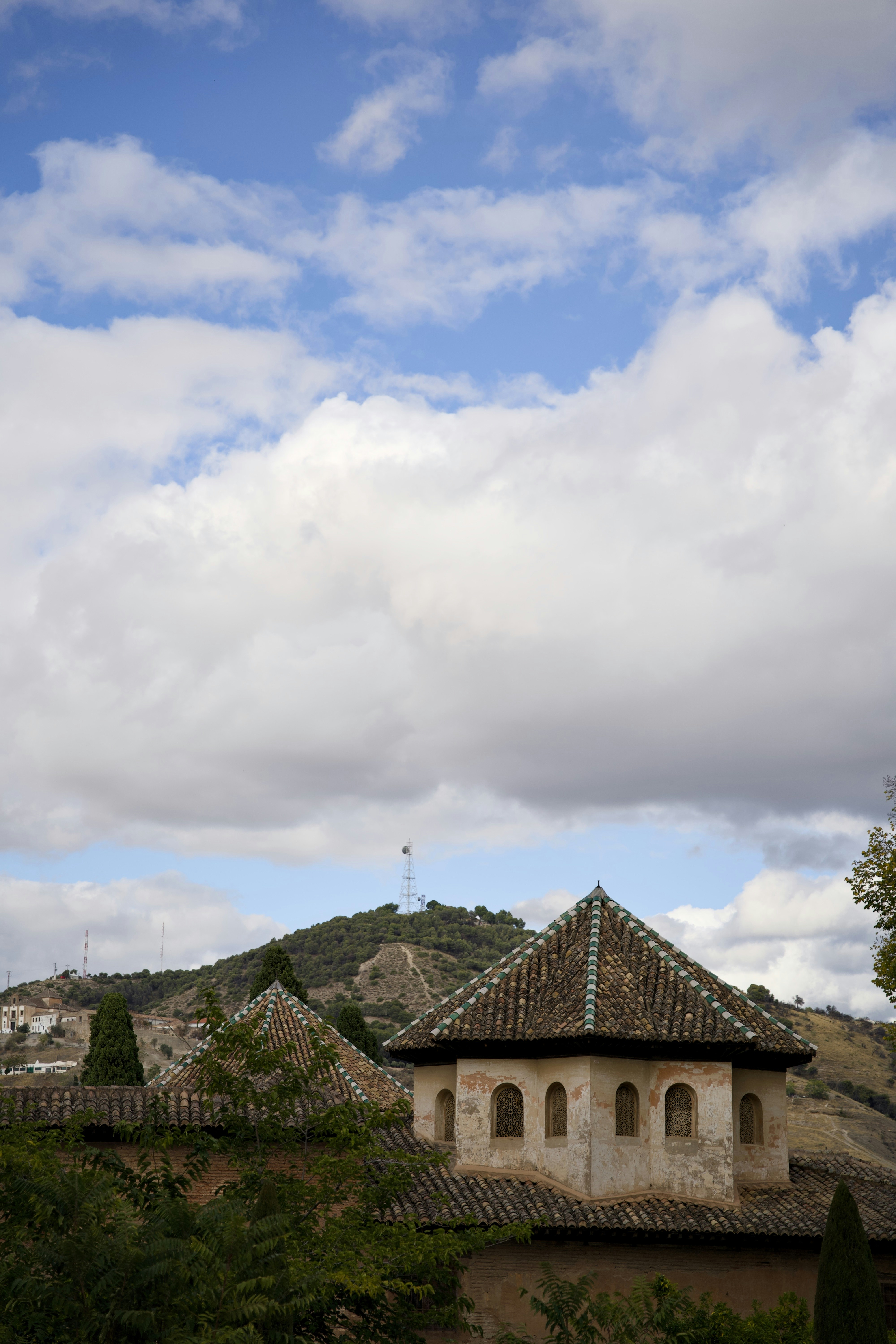 Clay-tiled Watchtower Crowned with Hills and Sky