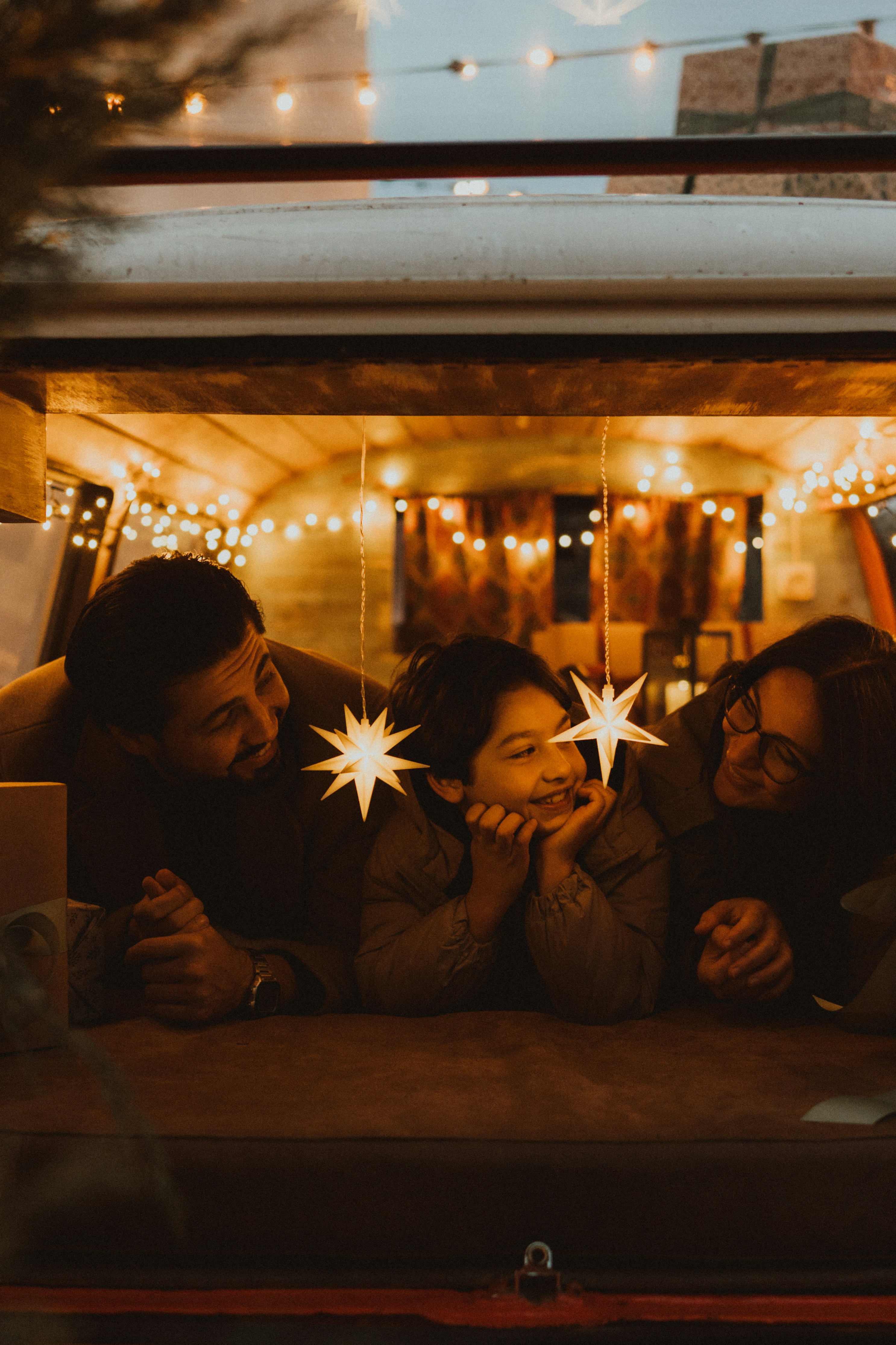 Starry Warmth: Family Moments Beneath Festive Lights