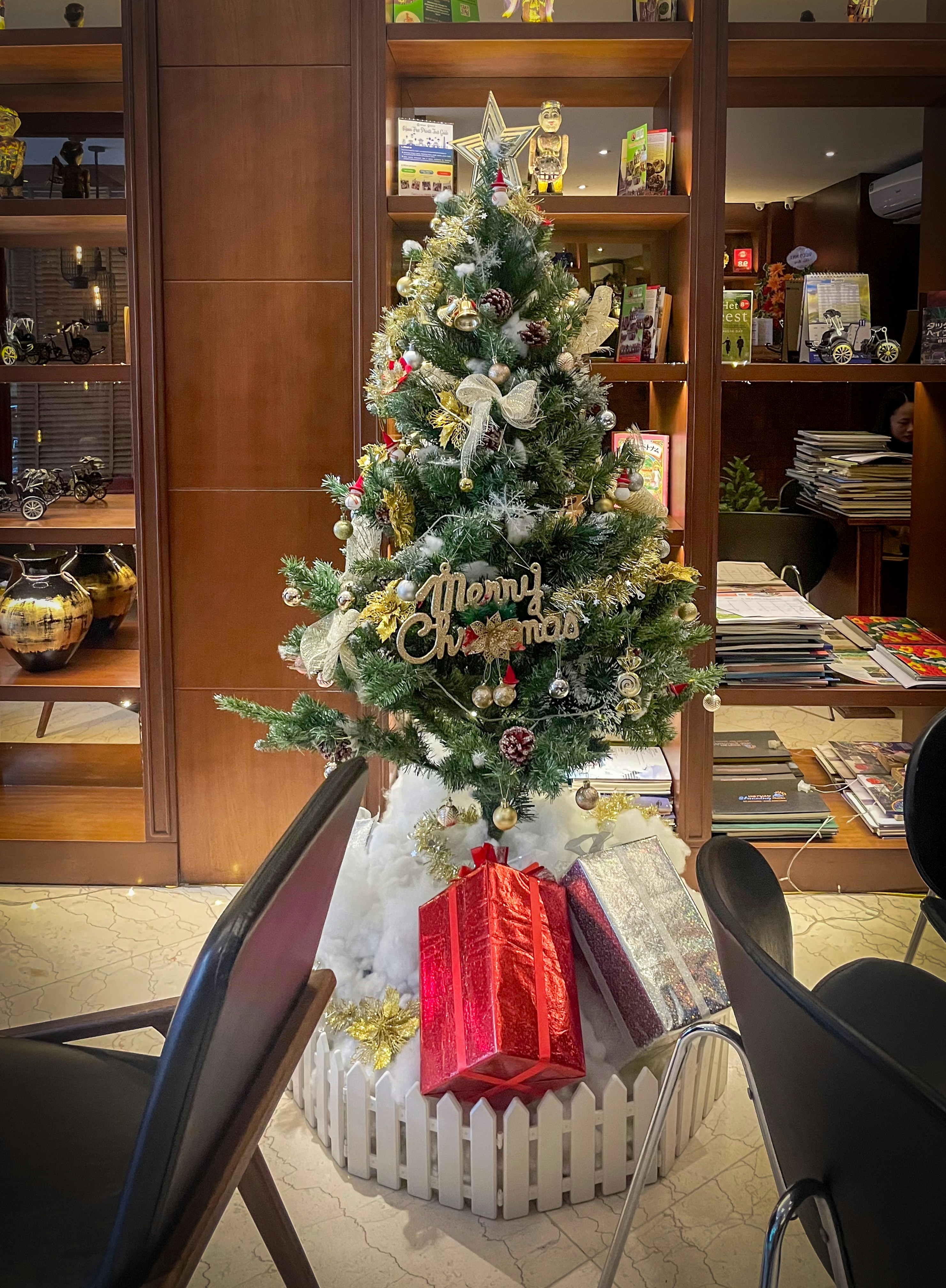 Festive Neon: A Christmas Tree Framed by a Cozy Bookshop Set