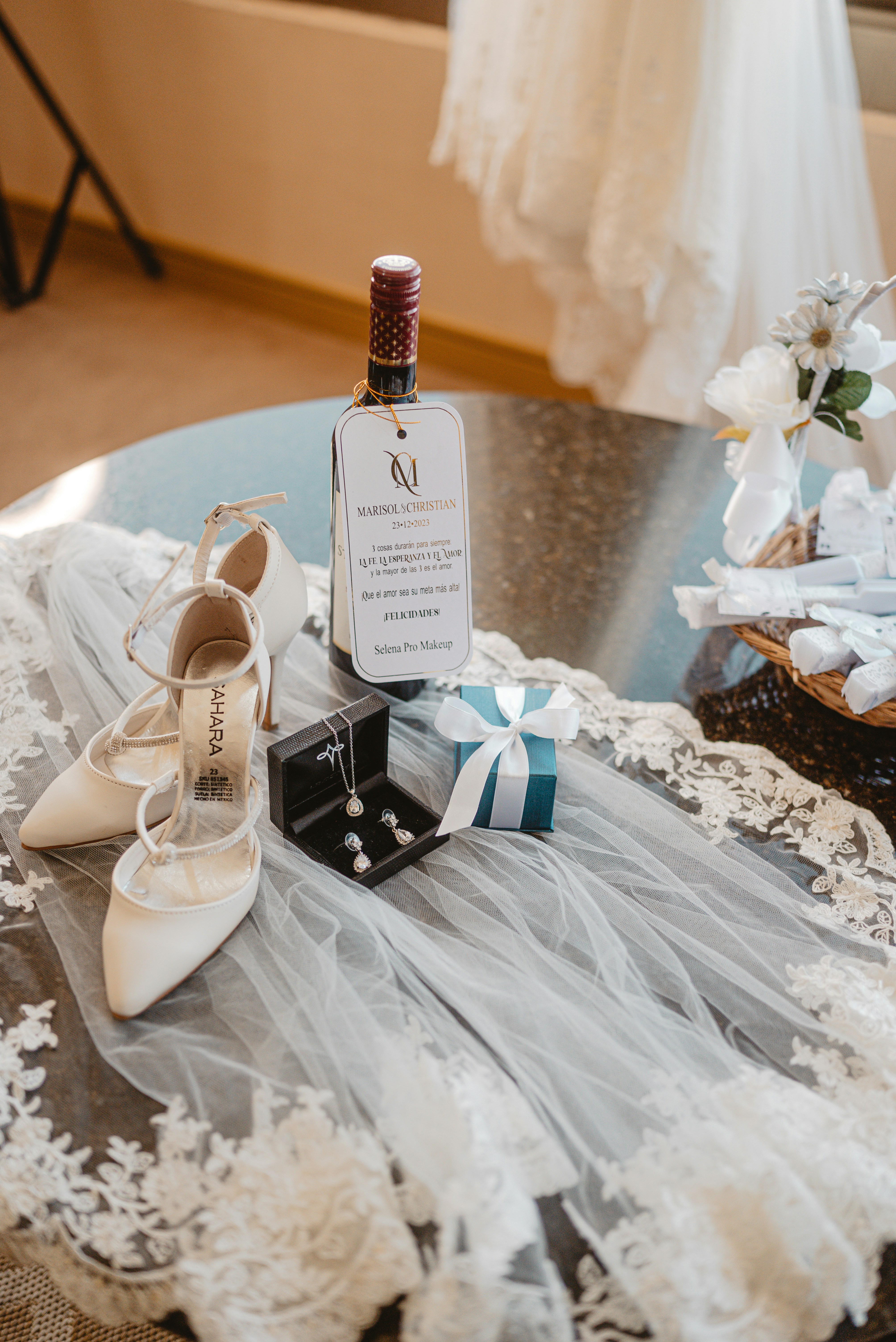 Bride’s Table: Laced Veil, Shoes, and Wine under Soft Window Light