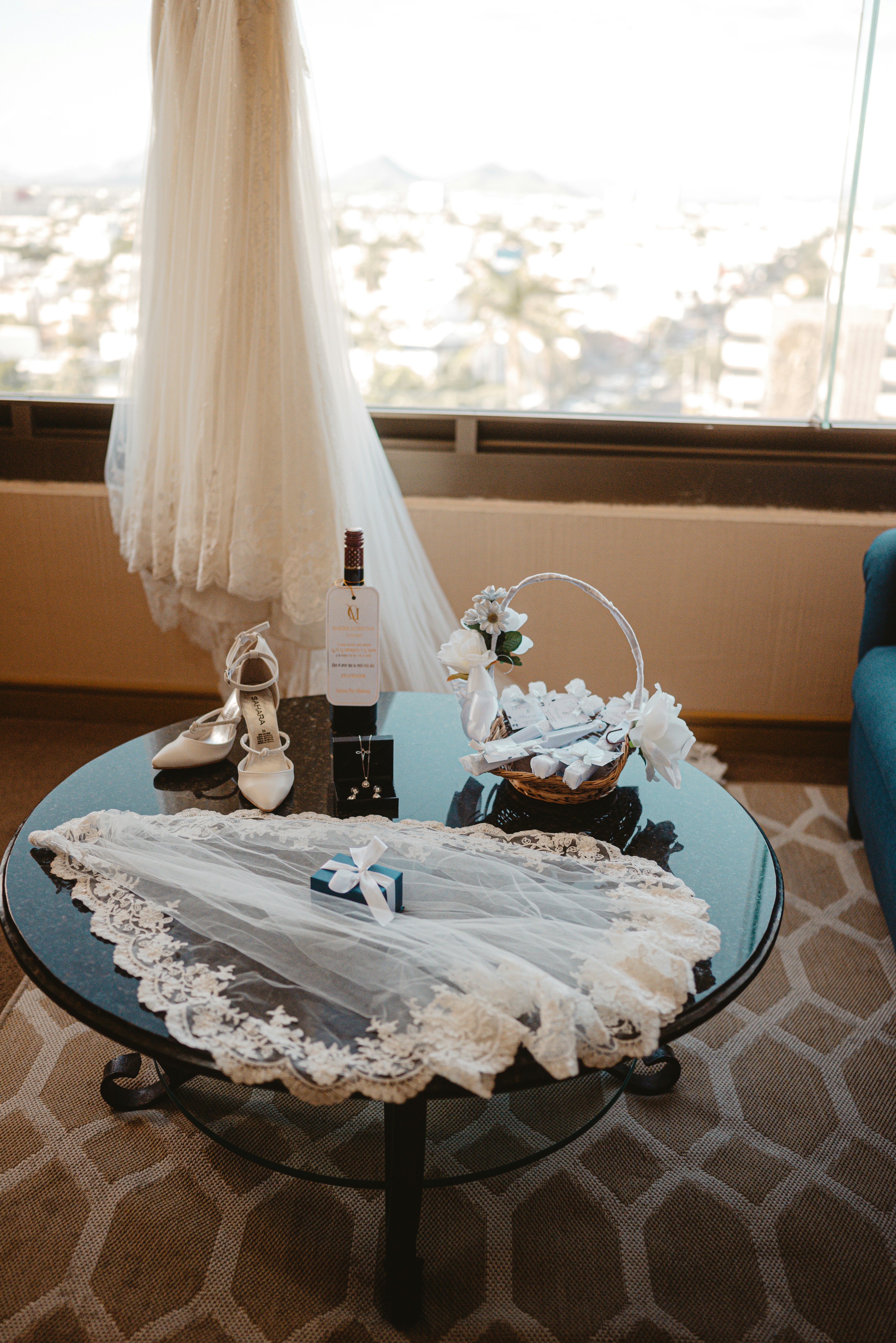 Veiled Elegance: A bridal keepsake on a lace-draped table with wedding essentials