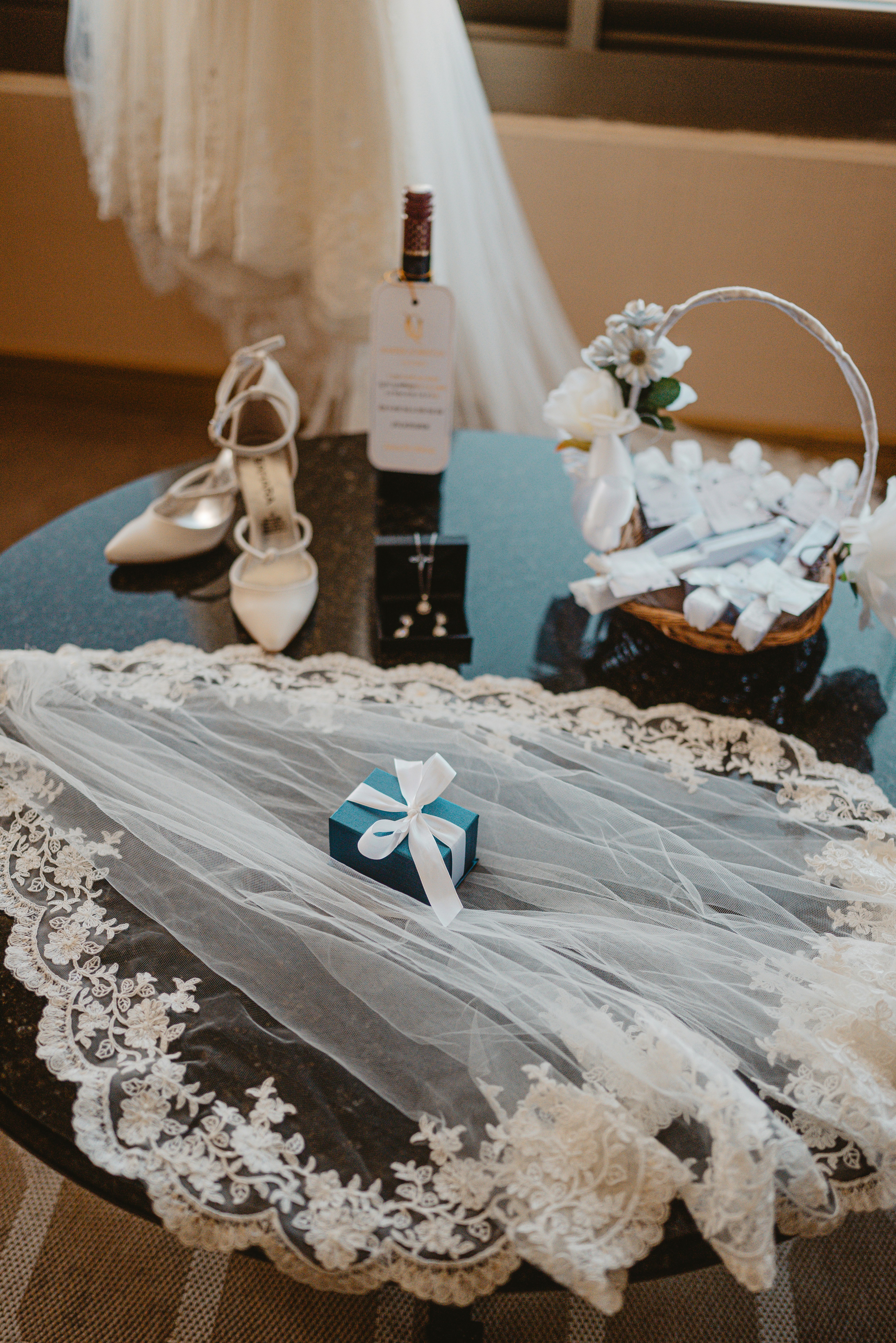 Blue Gift on Lace: Wedding Keepsake on a Veiled Table
