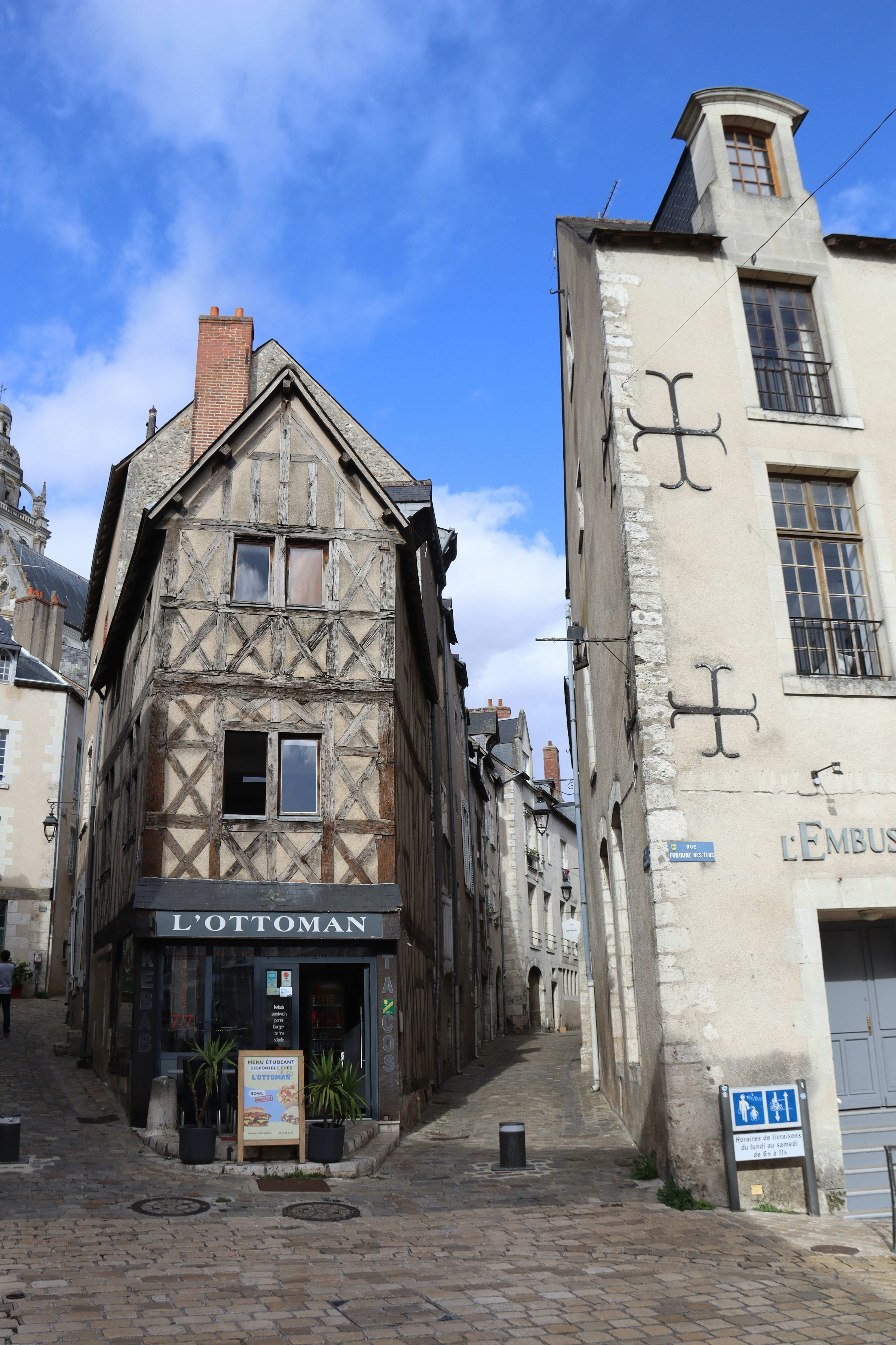 Narrow street with old buildings and blue sky photo – Free Restaurant ...