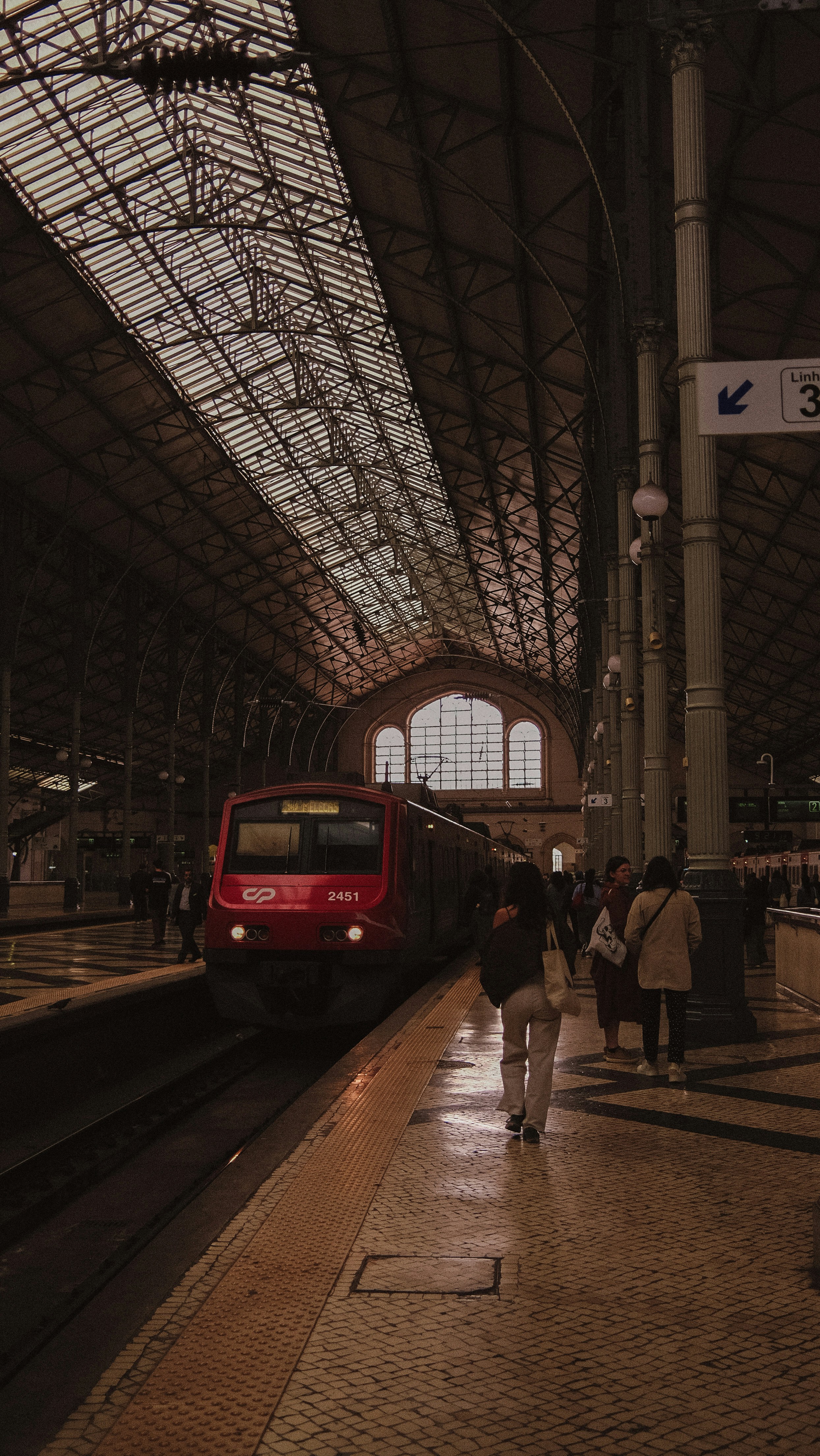 Red Commuter at the Station: Steel Arches and Echoes of Rails