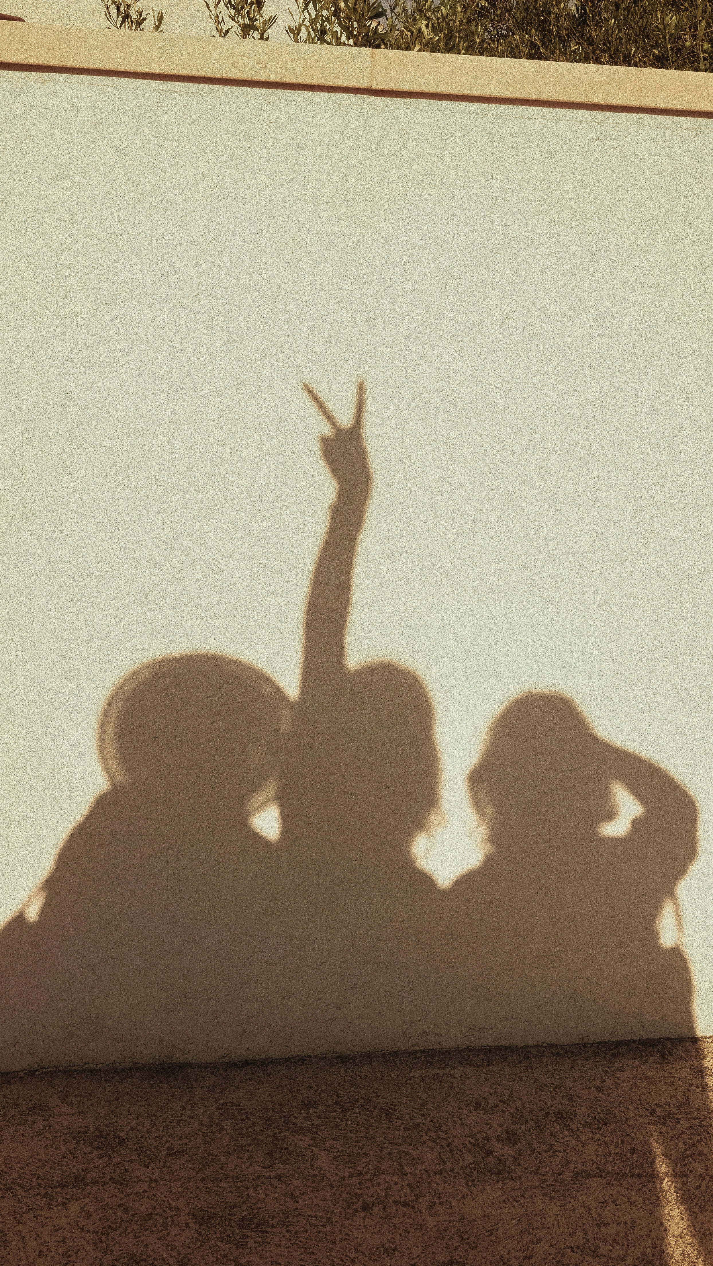 Shadows of three friends making peace sign gesture. photo – Free Girls ...