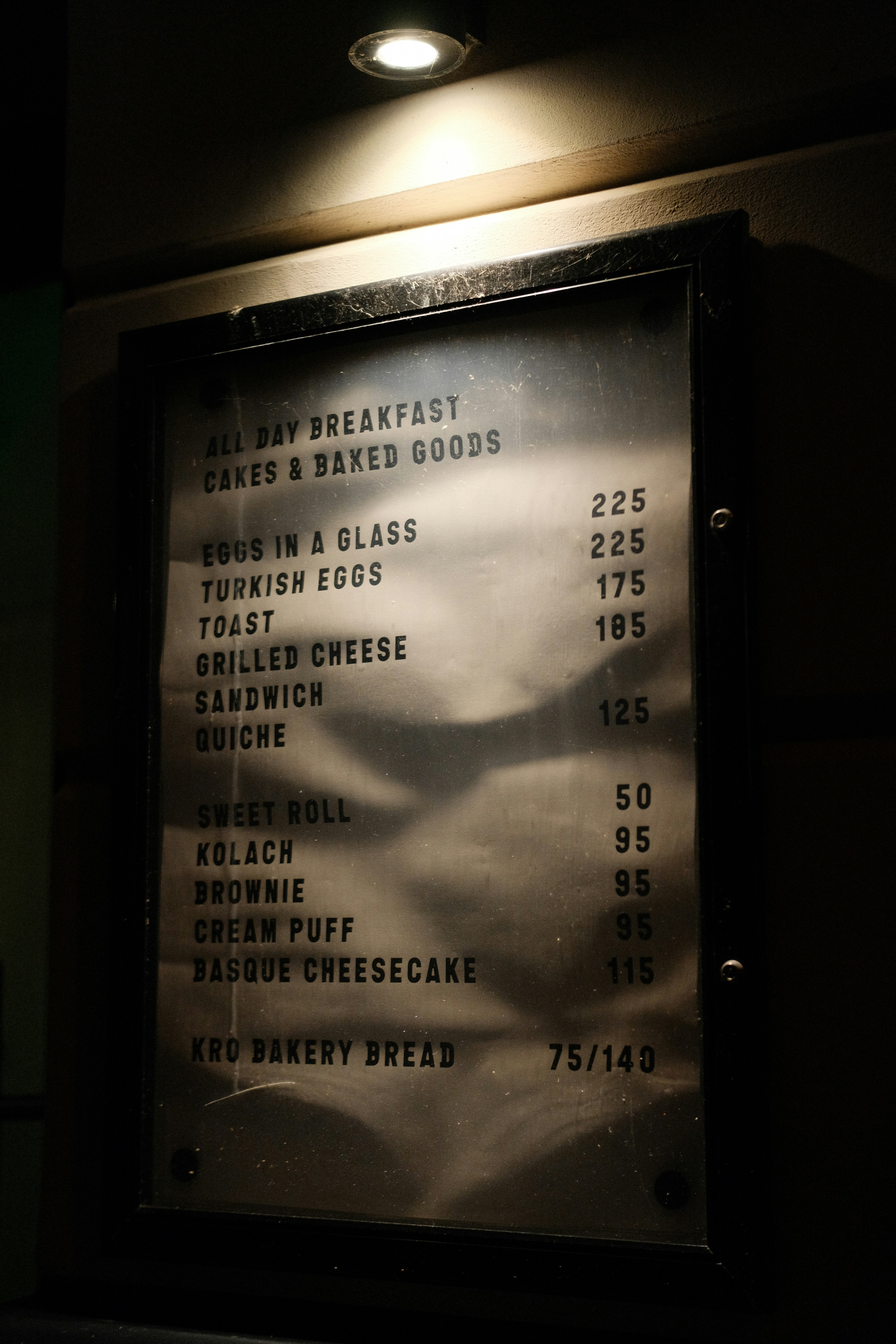 Menu board showing breakfast options and baked goods