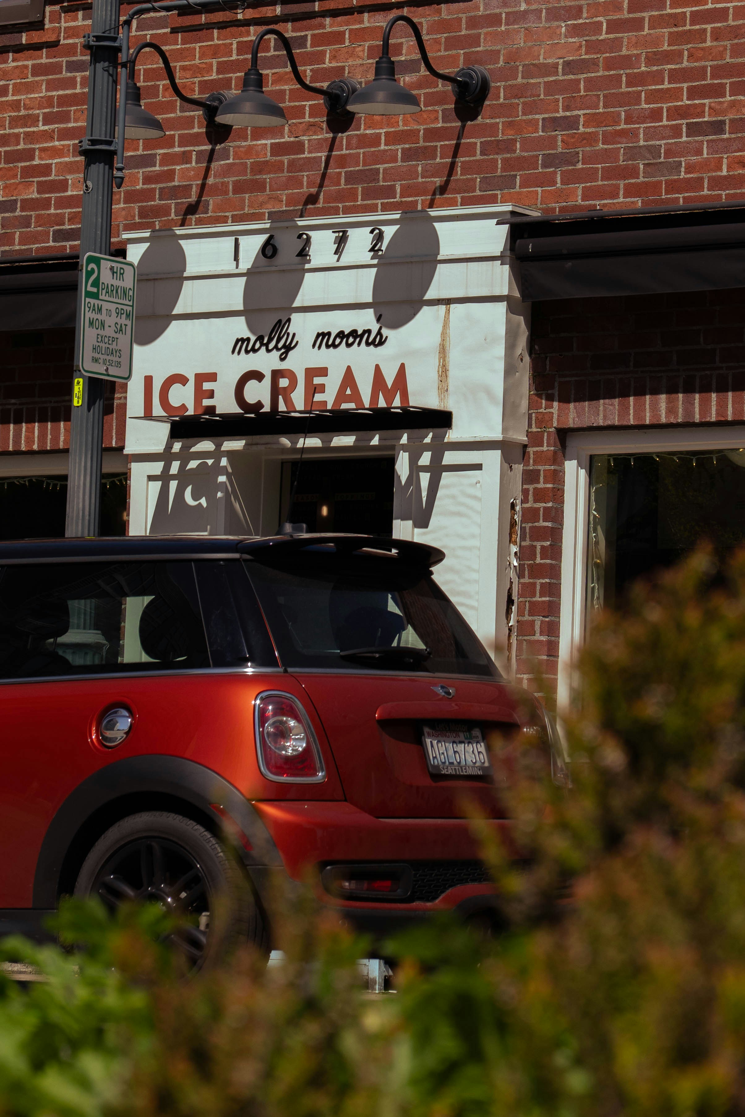 Brick storefront, iced in red: a street-level view of Molly Moon’s Ice Cream