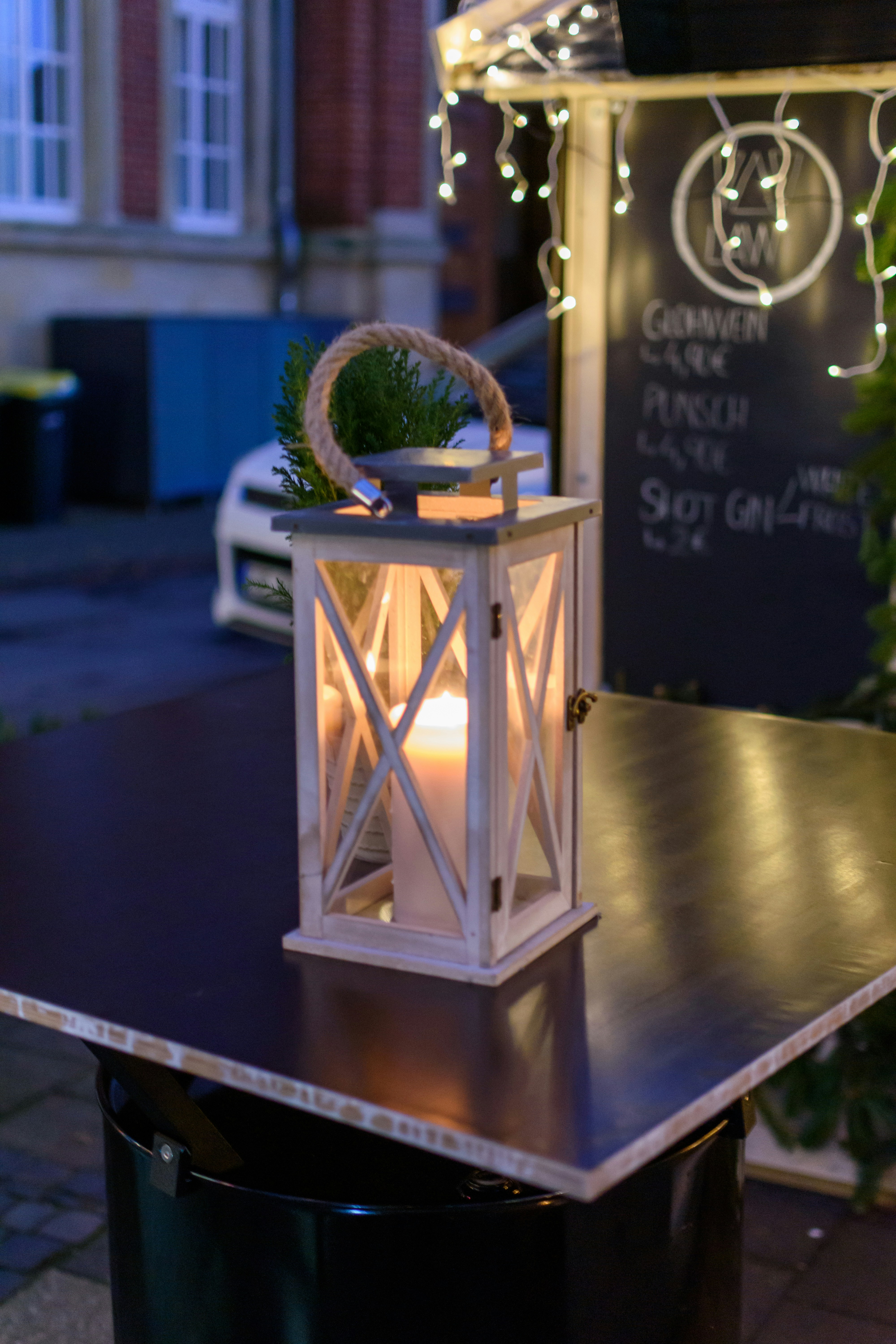 Glowing Lantern on a Dusk-Set Outdoor Counter