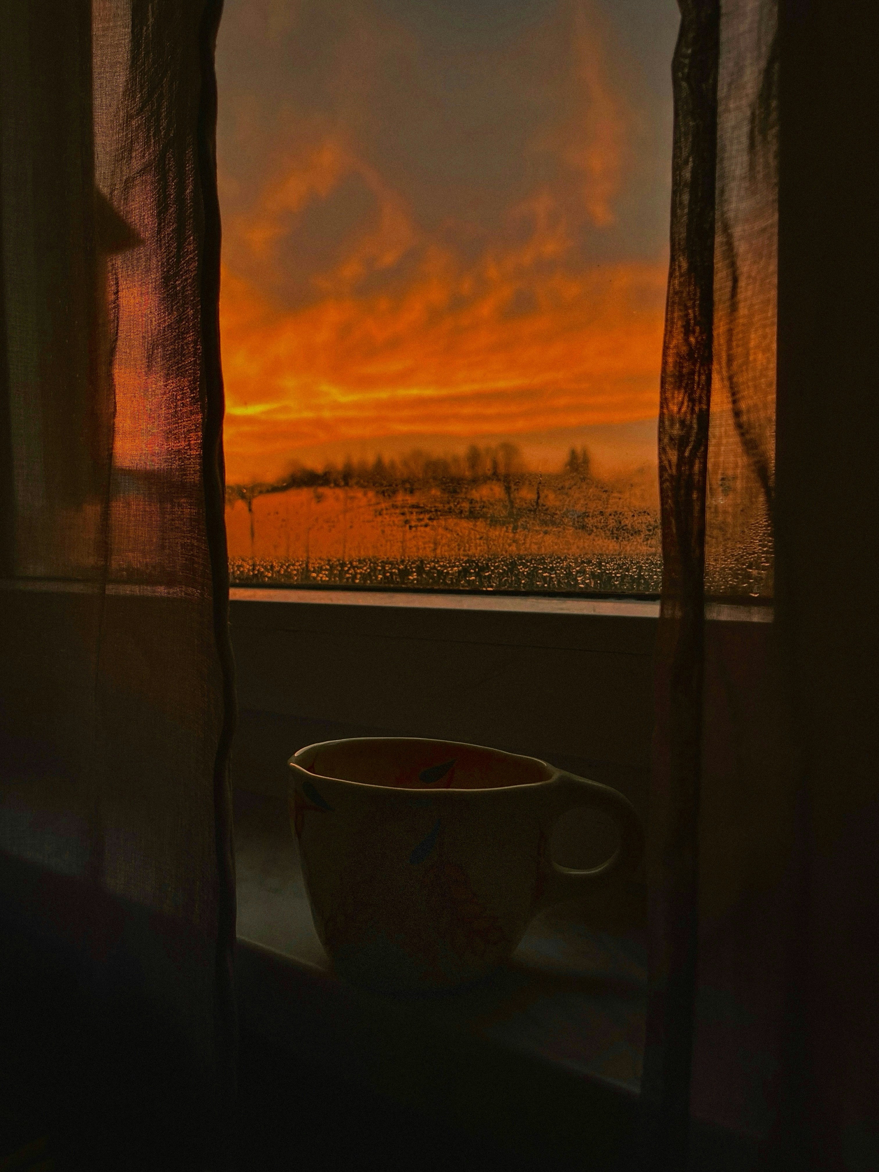 Sunset Through Curtains Over a Quiet Window Sill