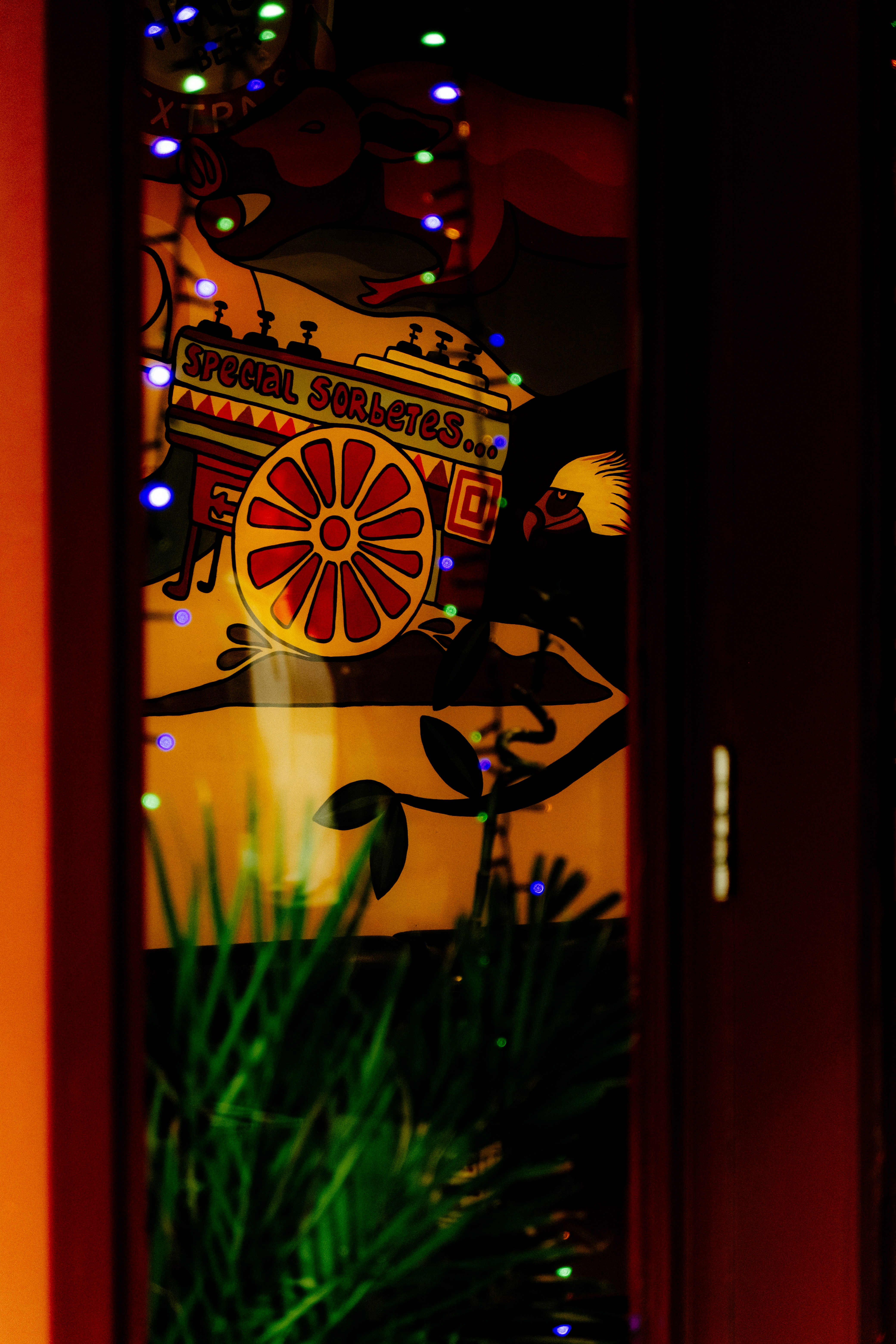 Neon Window Carousel: A Nighttime Glimpse into a Festive Scene