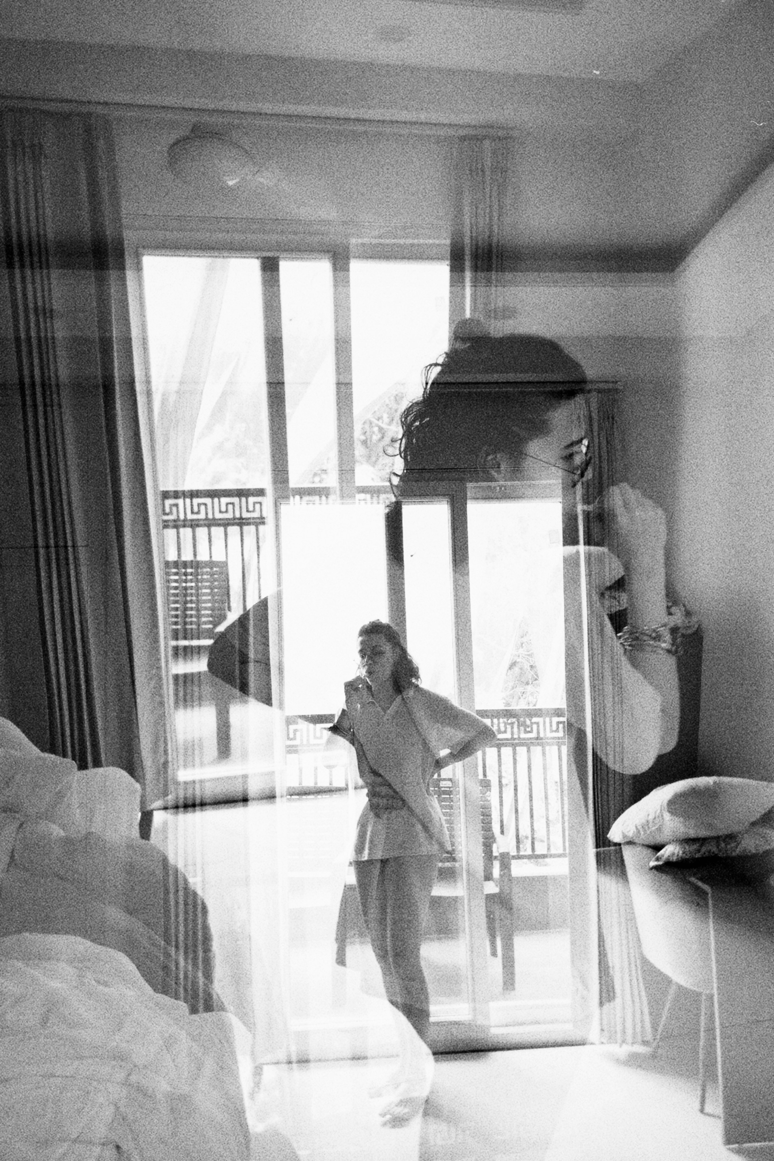 Double Vision in Glass: A Ghostly Self-Portrait in Transit