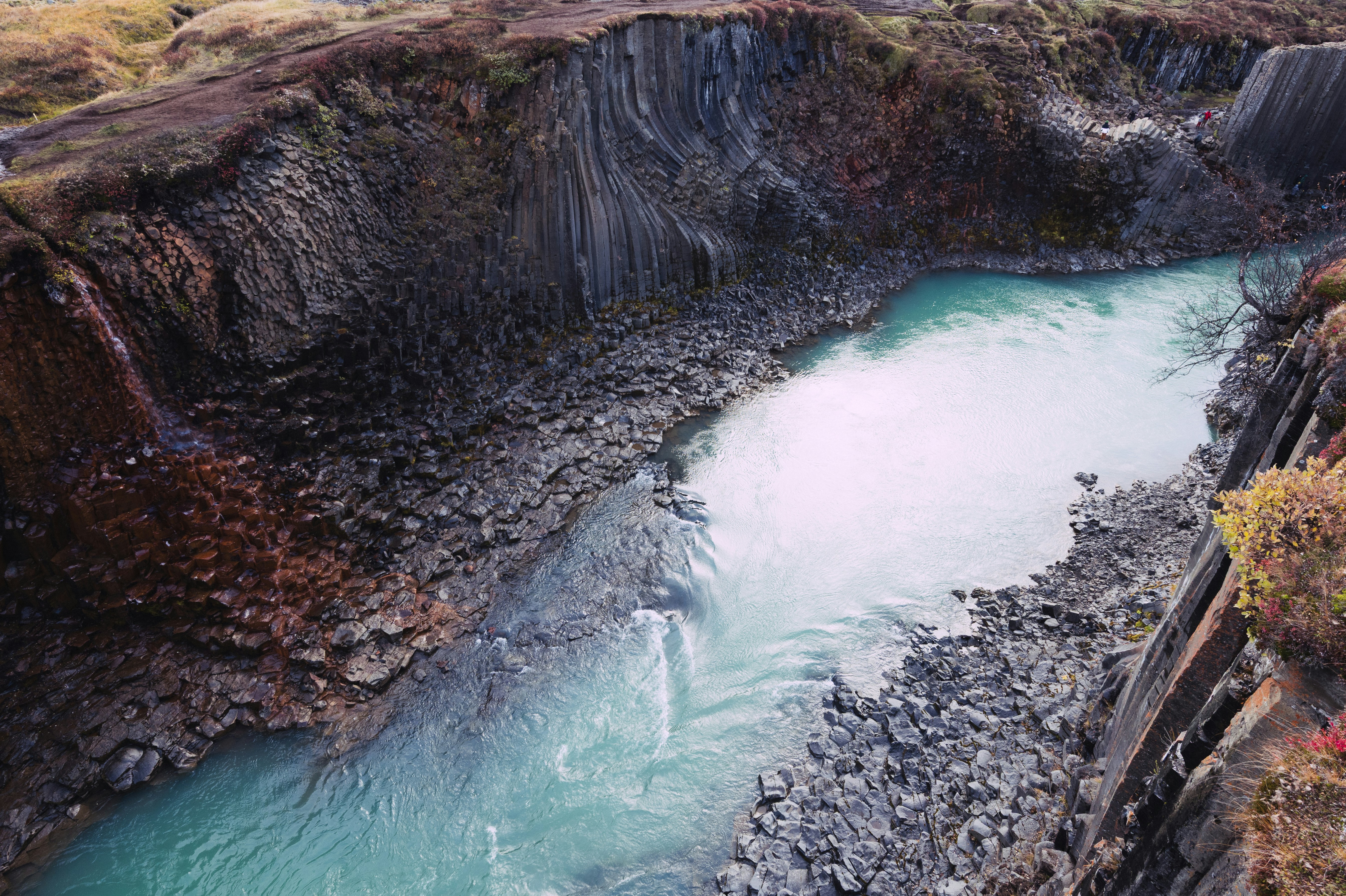 Aqua Furnace: Turquoise River between Midnight Basalts