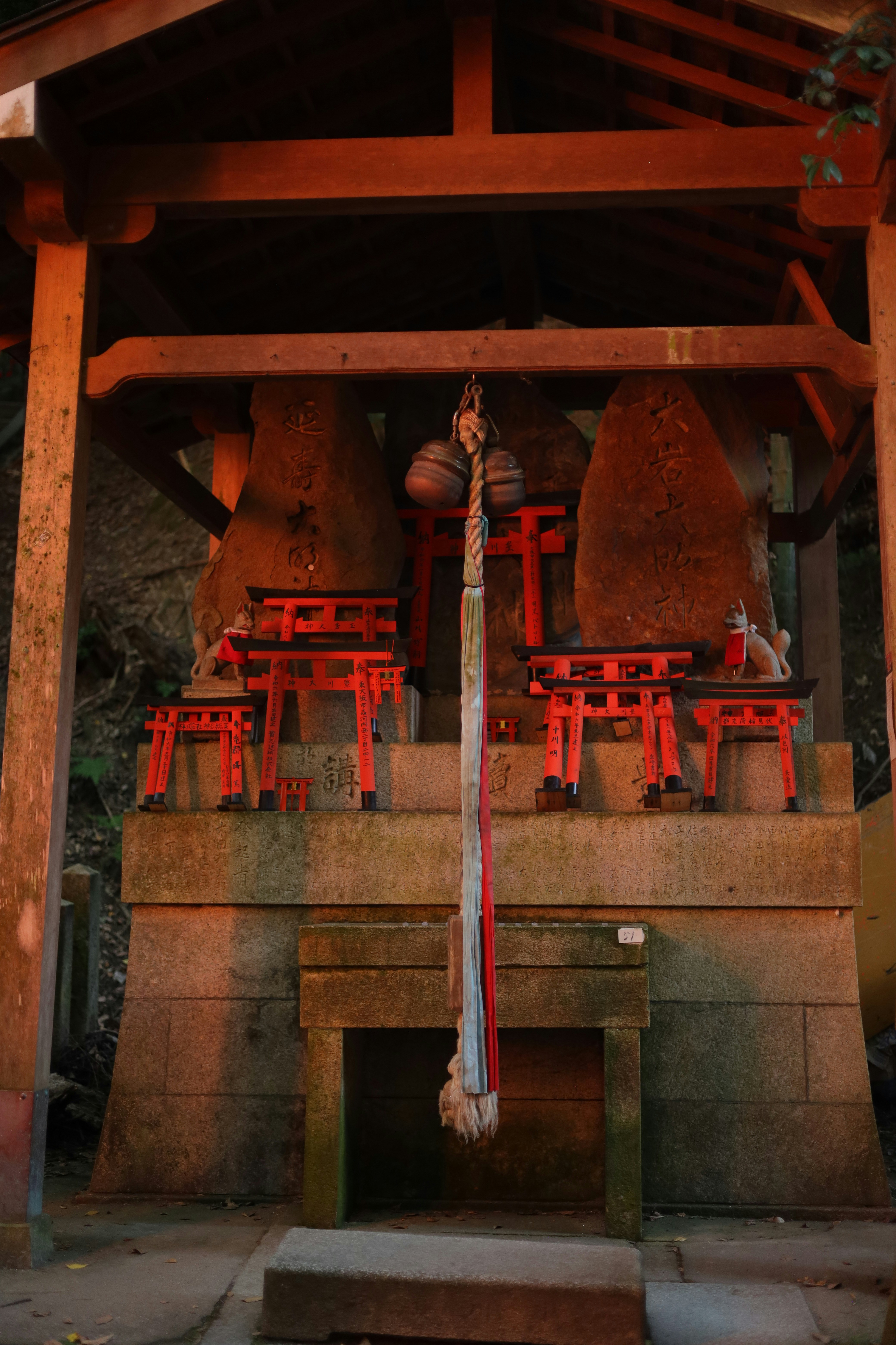 Crimson Shrine Altar: Red Lanterns, Ropes, and Stone Offerings