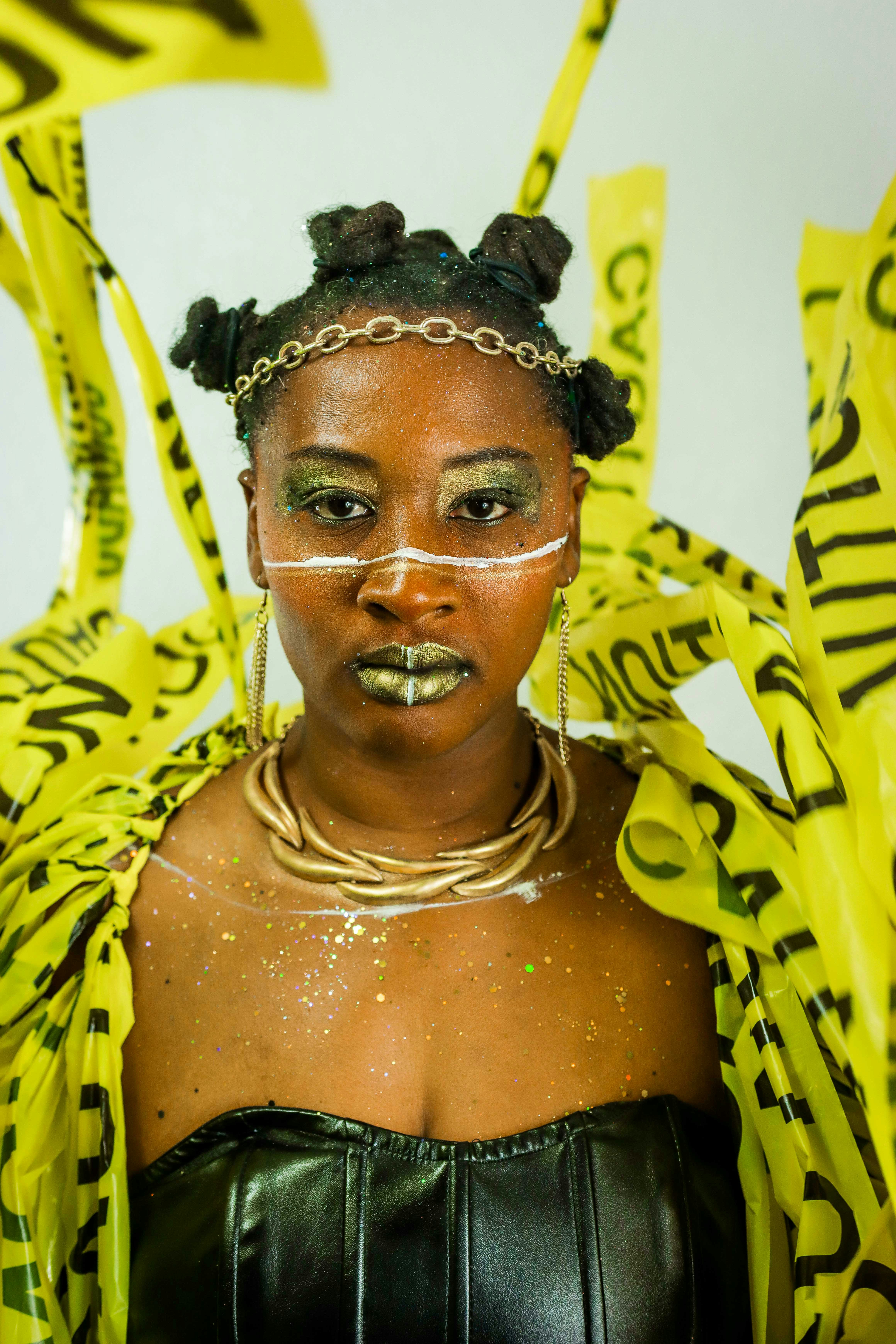 Glow in Gold: A Regal Portrait Amid Neon Caution Tape