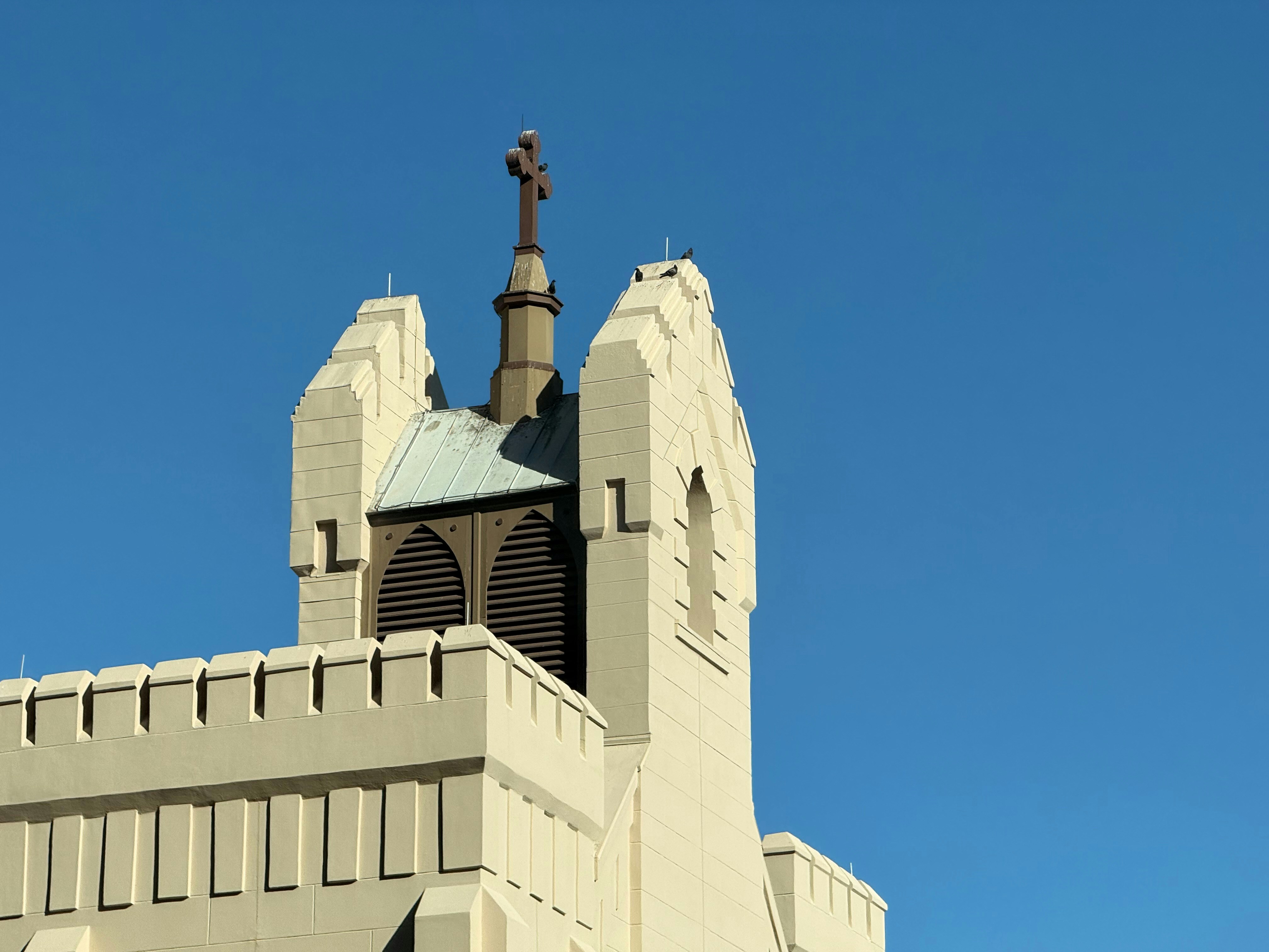 Stone Sculpted Tower Reaching Toward a Clear Sky
