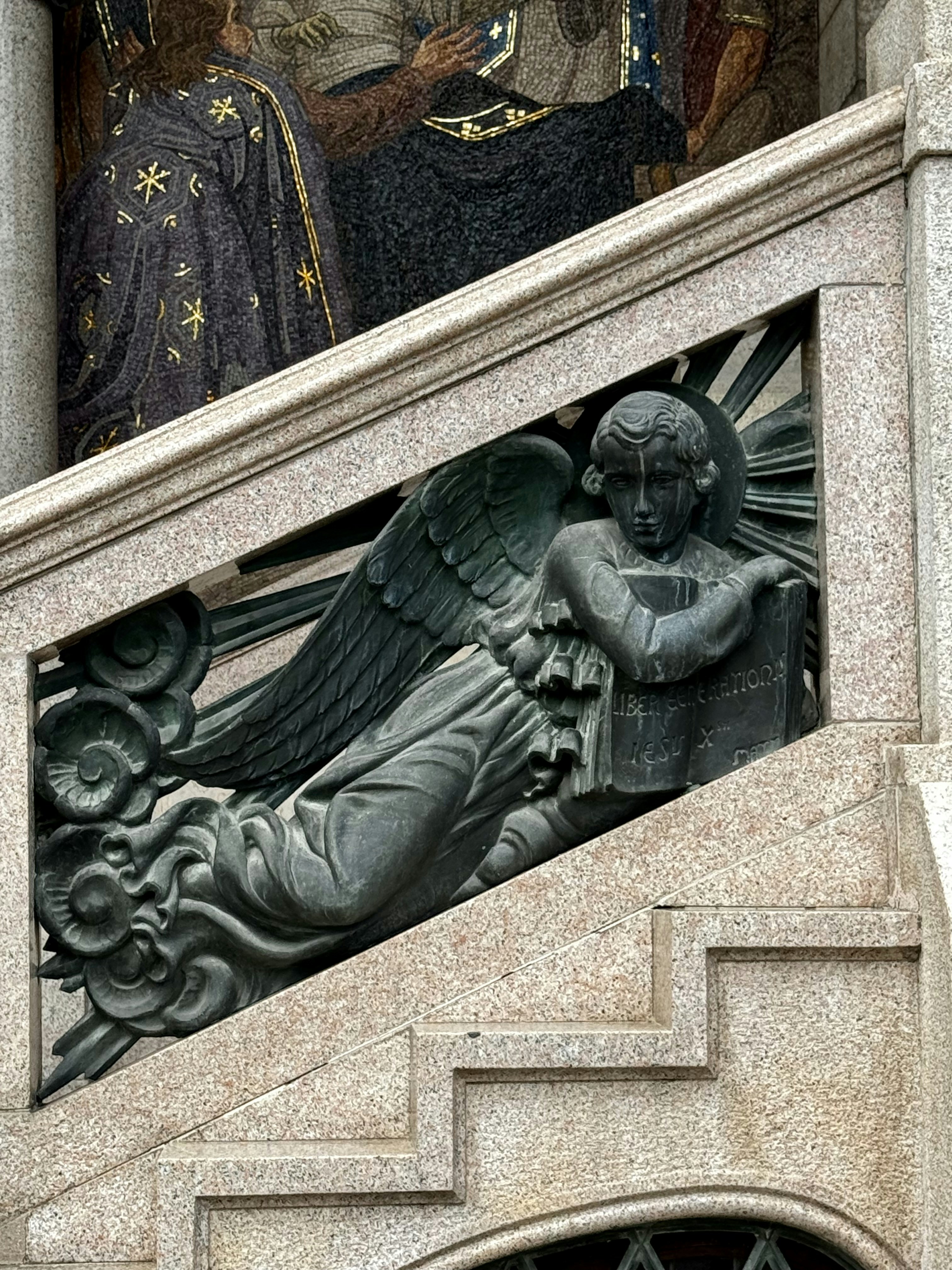 Winged Guardian Carved in Stone Above the Marble Staircase