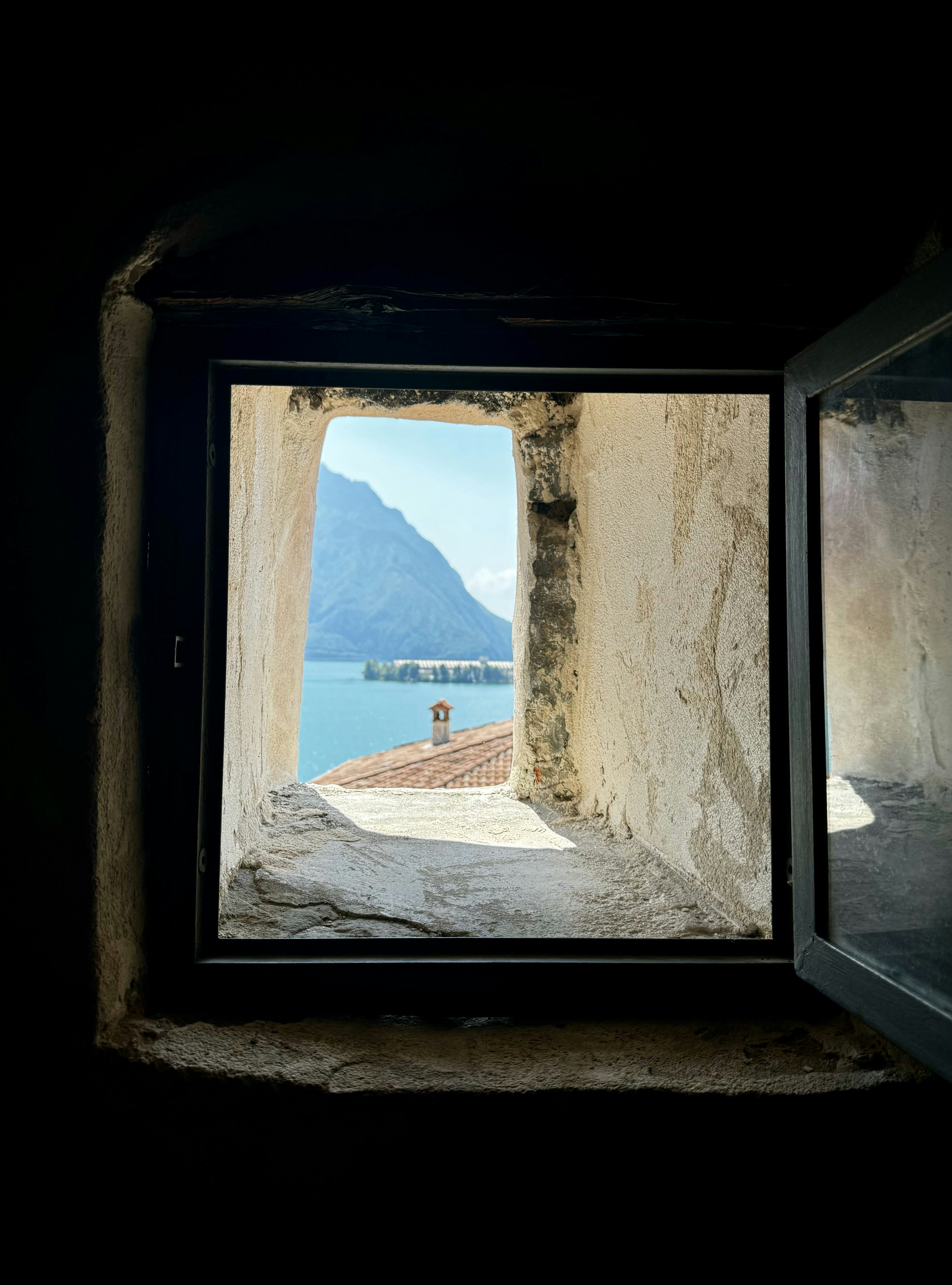 Window to the Lake: A Meditative Sea Vista Through a Stone Frame