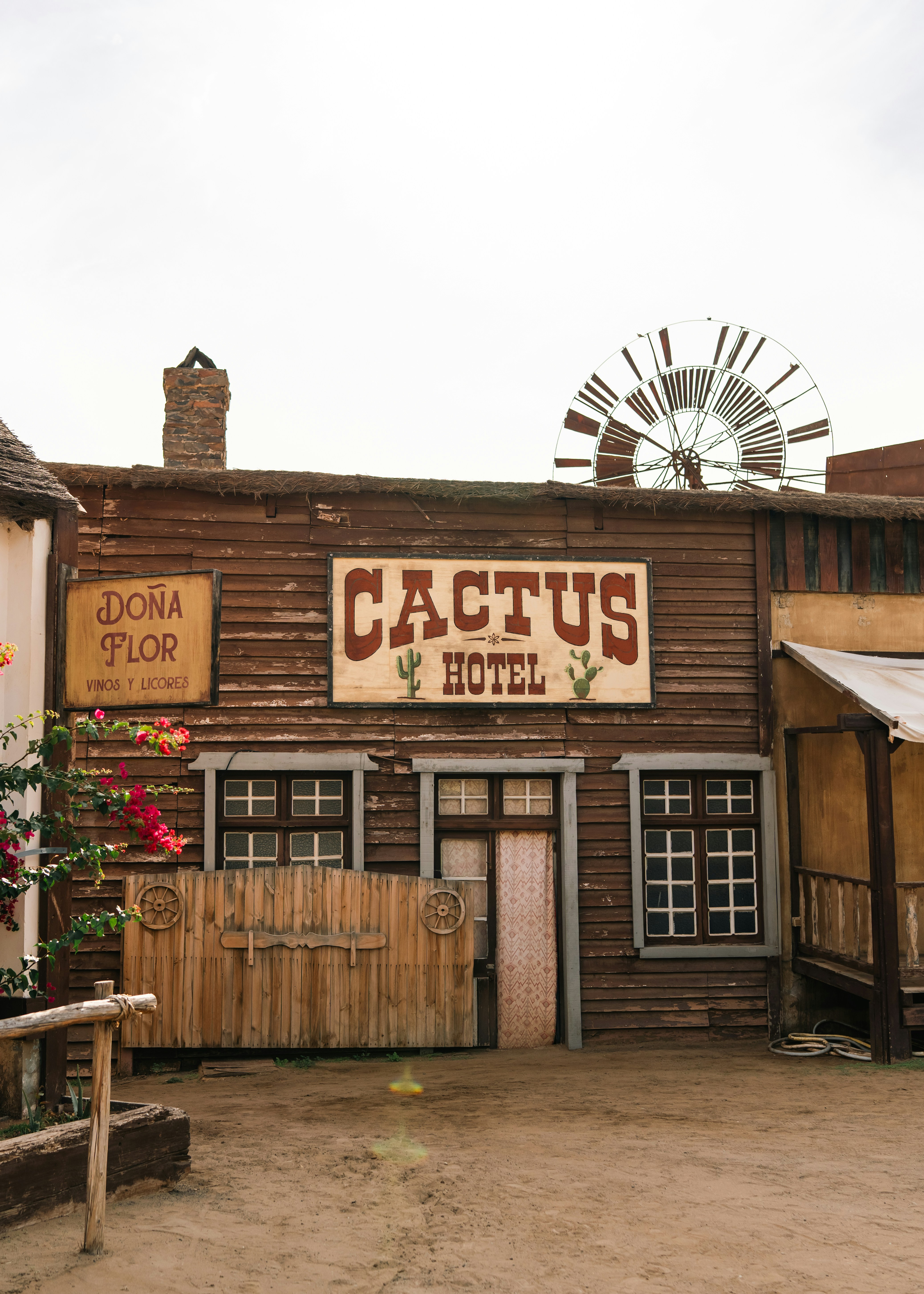 Cactus Hotel Front: Weathered Wood and Windmill Silhouette